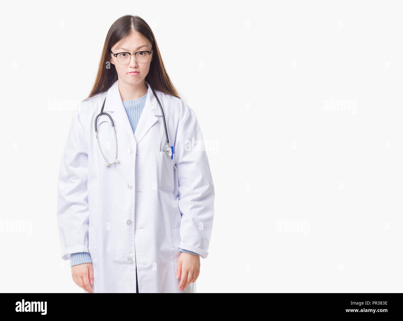 Young Chinese doctor woman over isolated background depressed and worry ...
