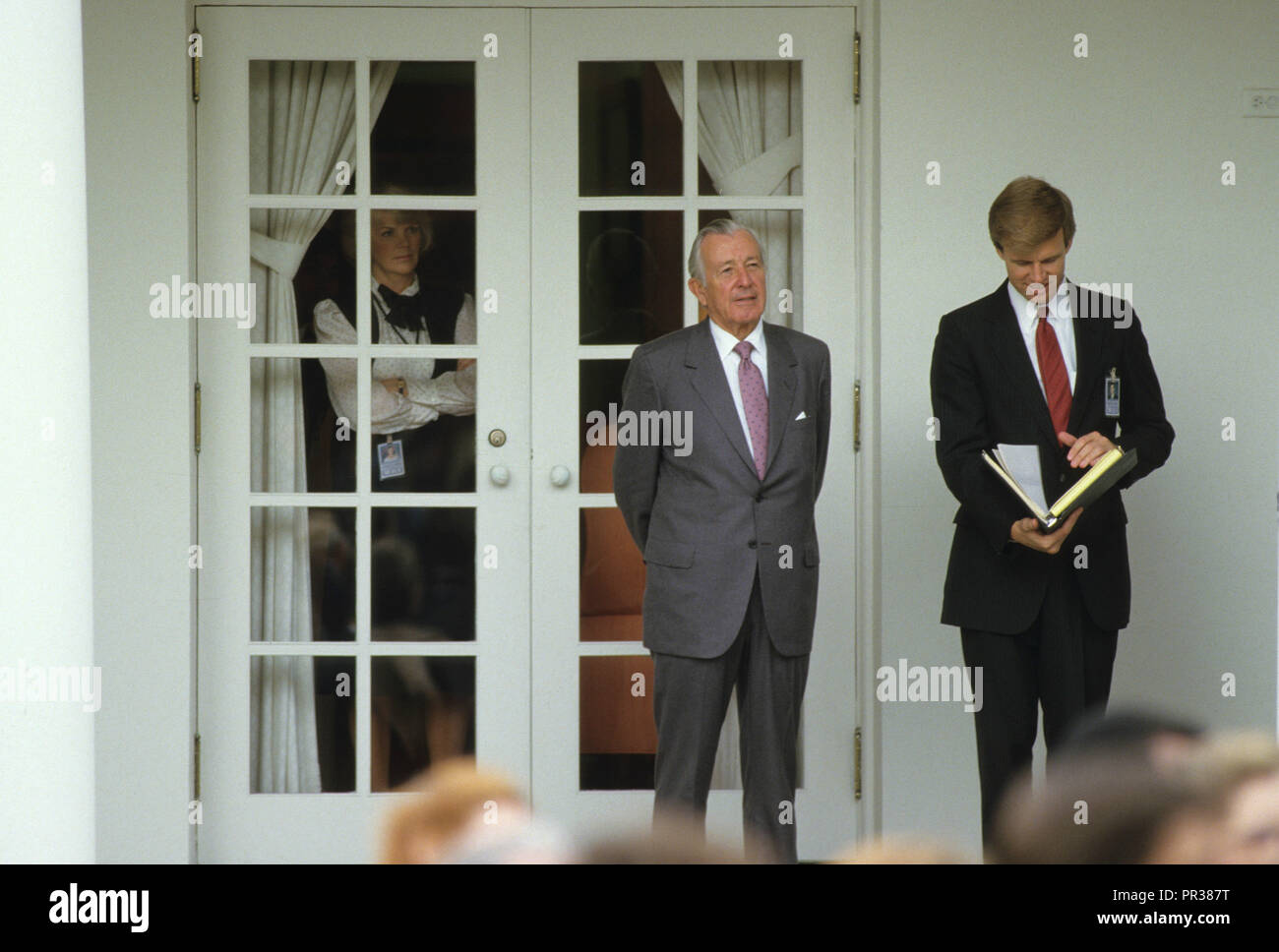 Sectretary of Treasury Don Regan watches President Reagan at a Rose ...