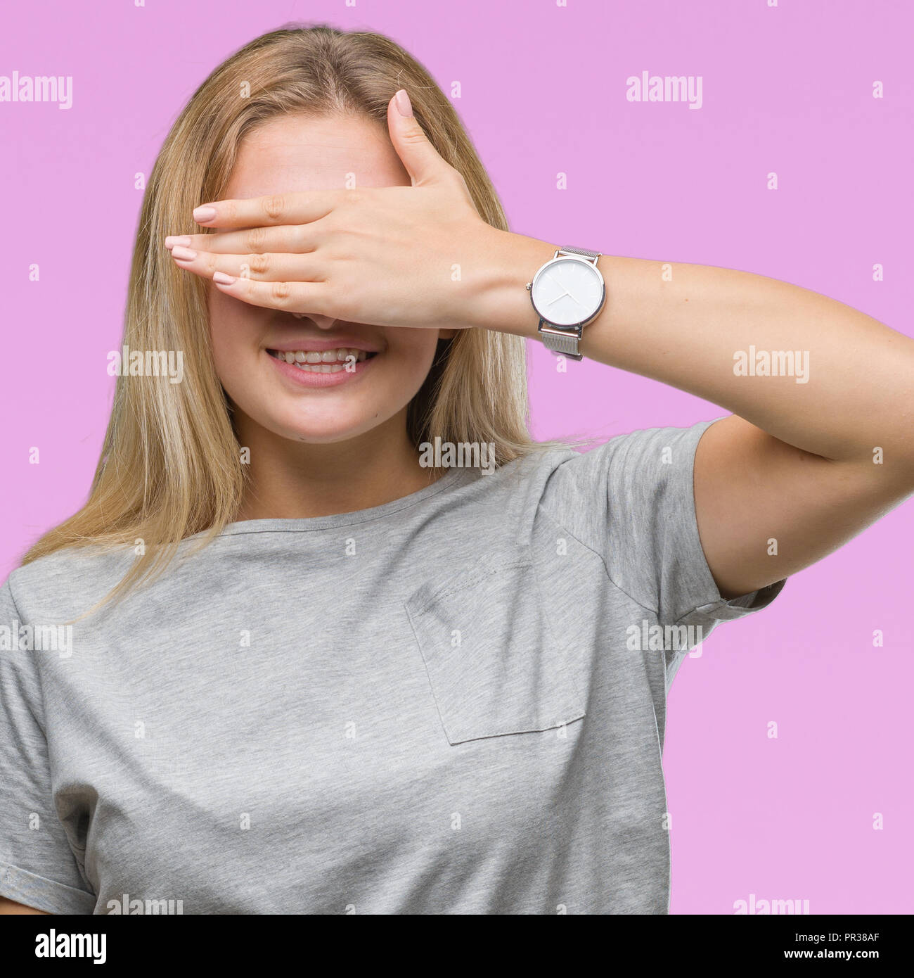 Woman Laughing Hand Over Mouth Stock Photos & Woman Laughing Hand Over ...