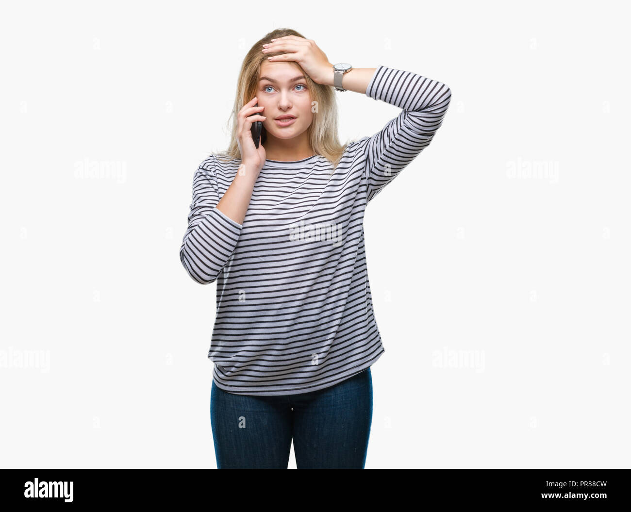 Young caucasian woman showing smartphone screen over isolated ...