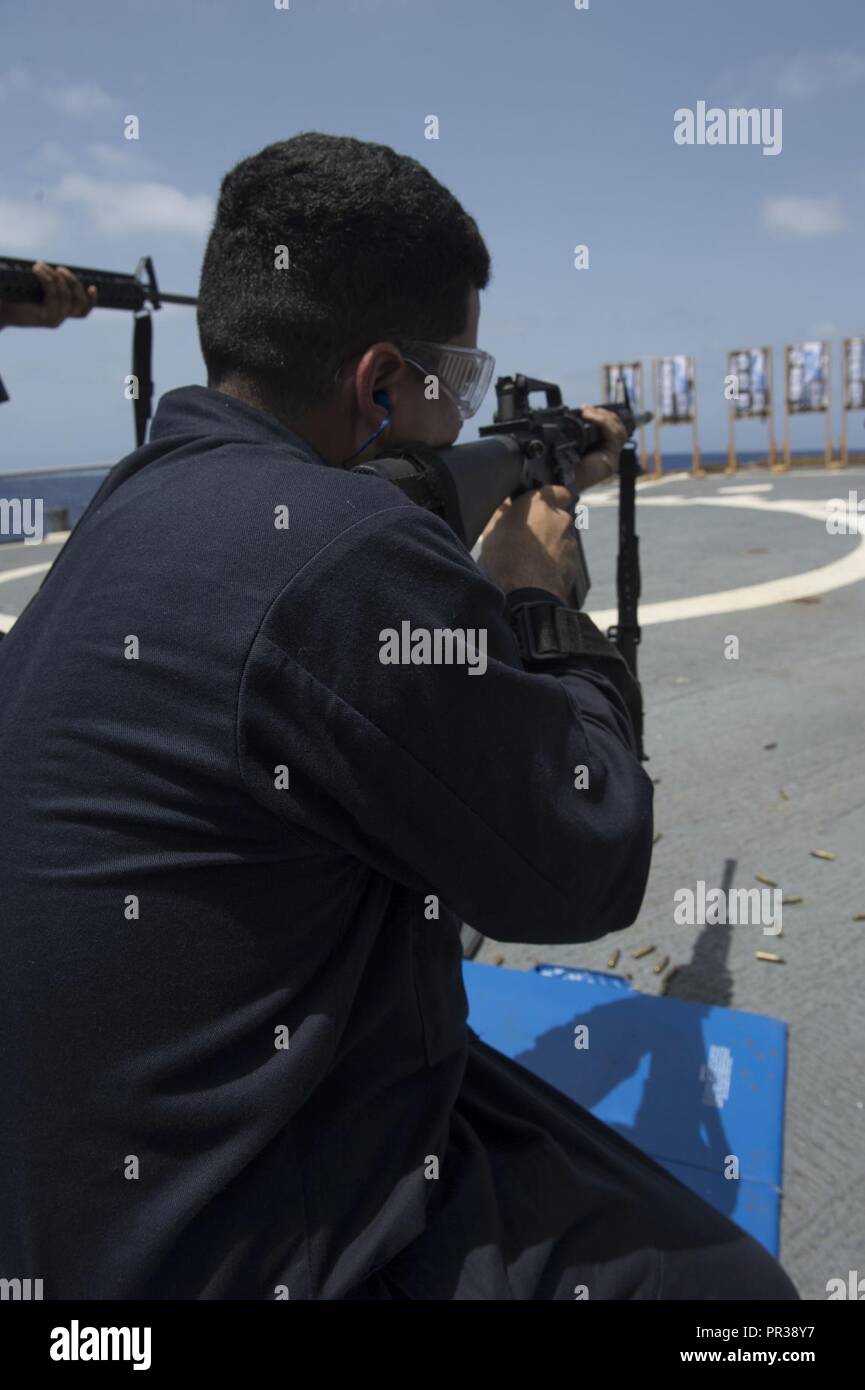 SEA (July 27, 2017) - Yeoman 2nd Class Peter Sanchez fires an M16 rifle ...