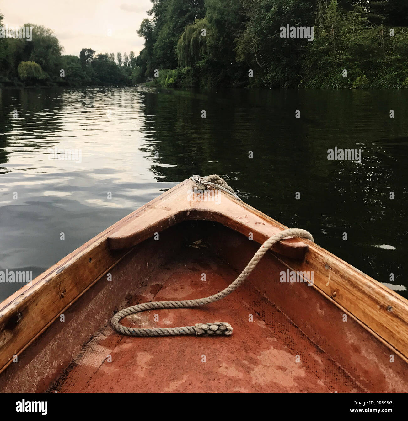 Wood Rowing boat on river, rustic rope, light and shadow painterly ...