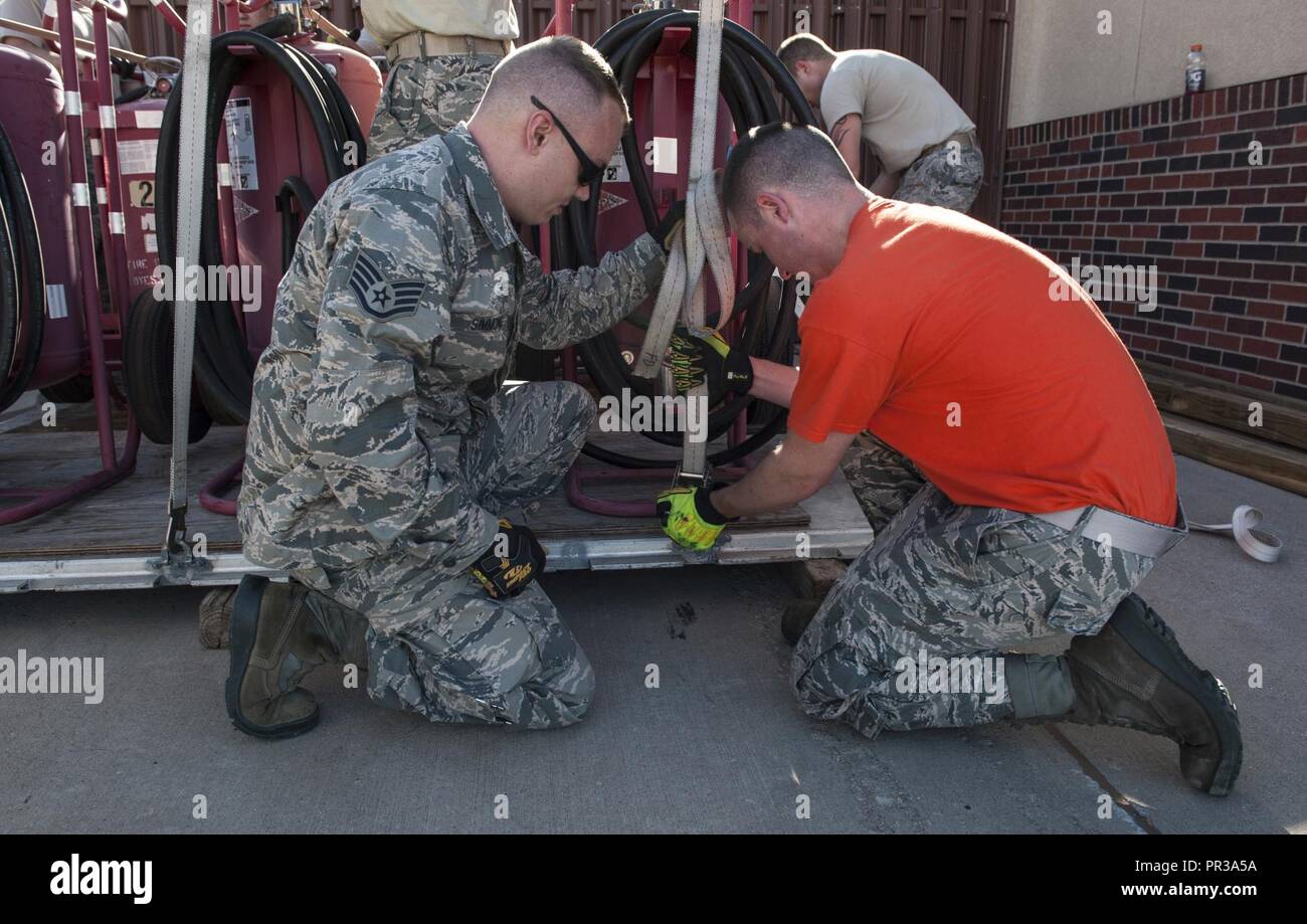 U.S. Air Force Staff Sgt. Gideon Simmons, left, 7th Logistics Readiness ...