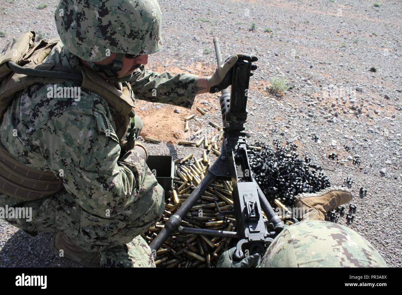 Assistant gunner U.S. Petty Officer 2nd Class Christopher Norberto ...