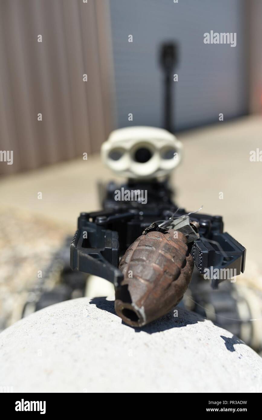 A Micro Tactical Ground Robot captures a mock grenade during EOD ...