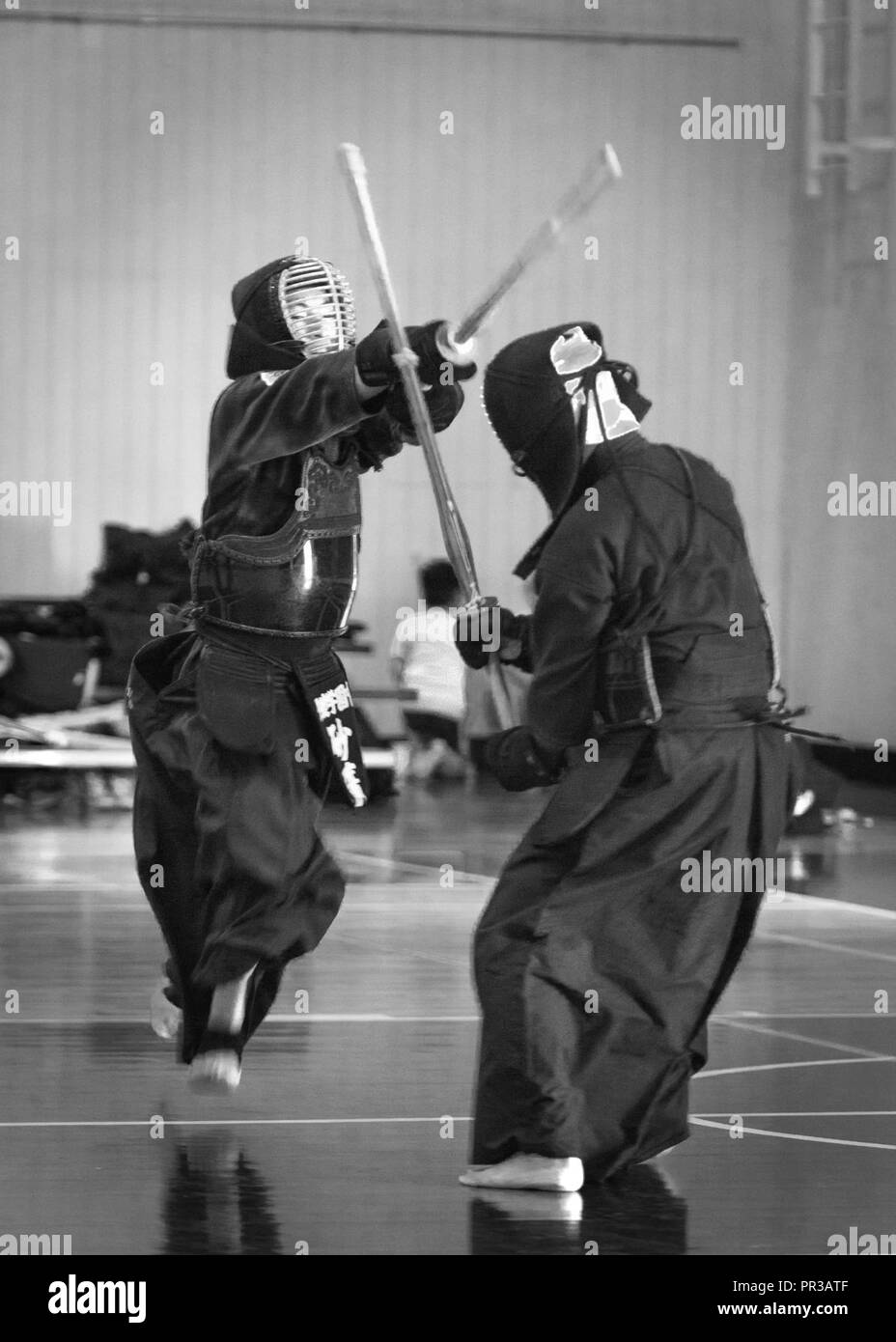 A kendo practitioner strikes his opponent’s head during the Kendo Club ...