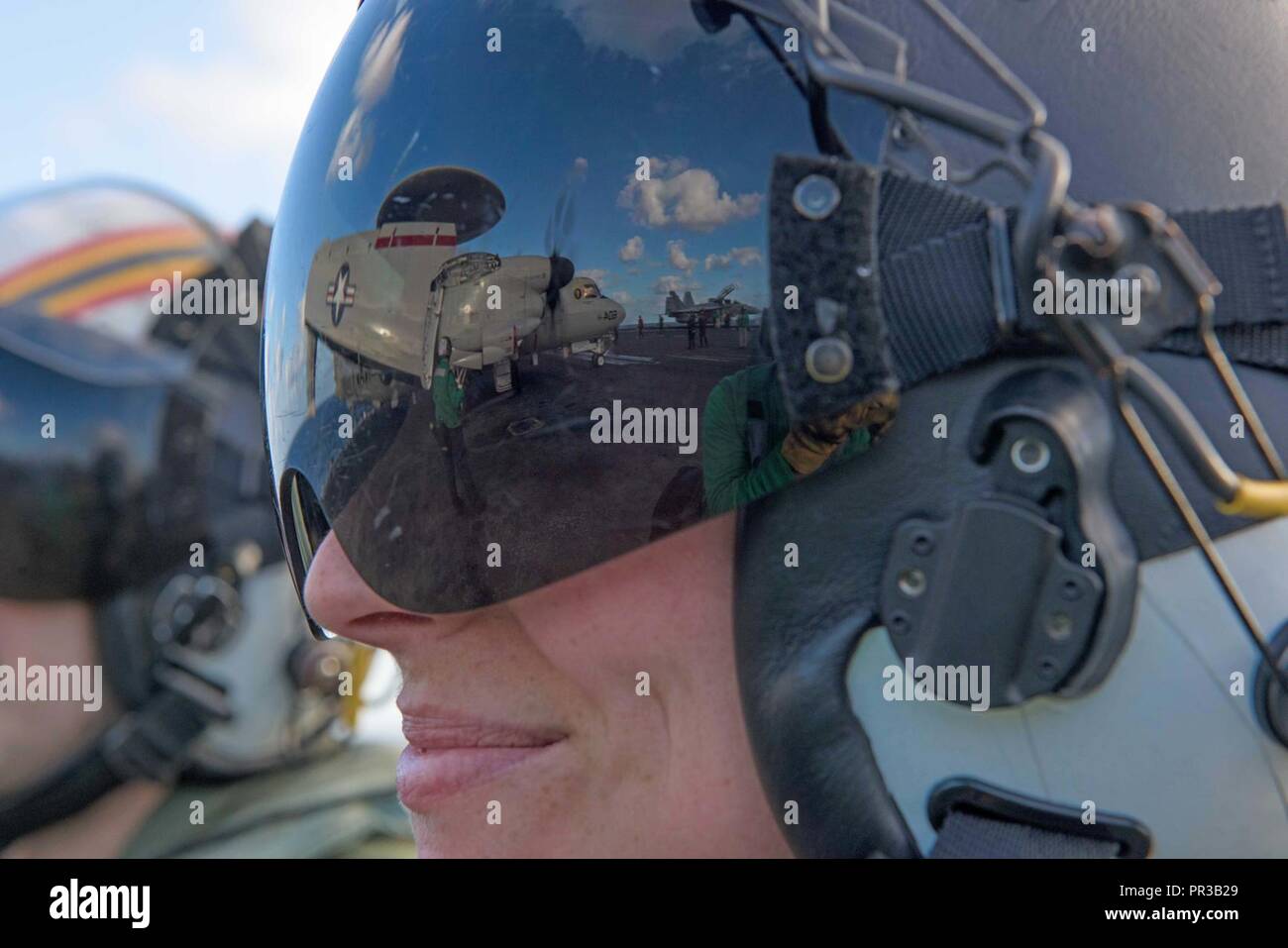 CORAL SEA (July 30, 2017) Pilots stand on the flight deck of USS Ronald ...