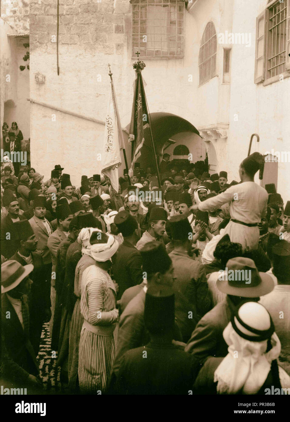 Holy Fire crowds. Lyd banners on way to Church of the Holy Sepulchre ...