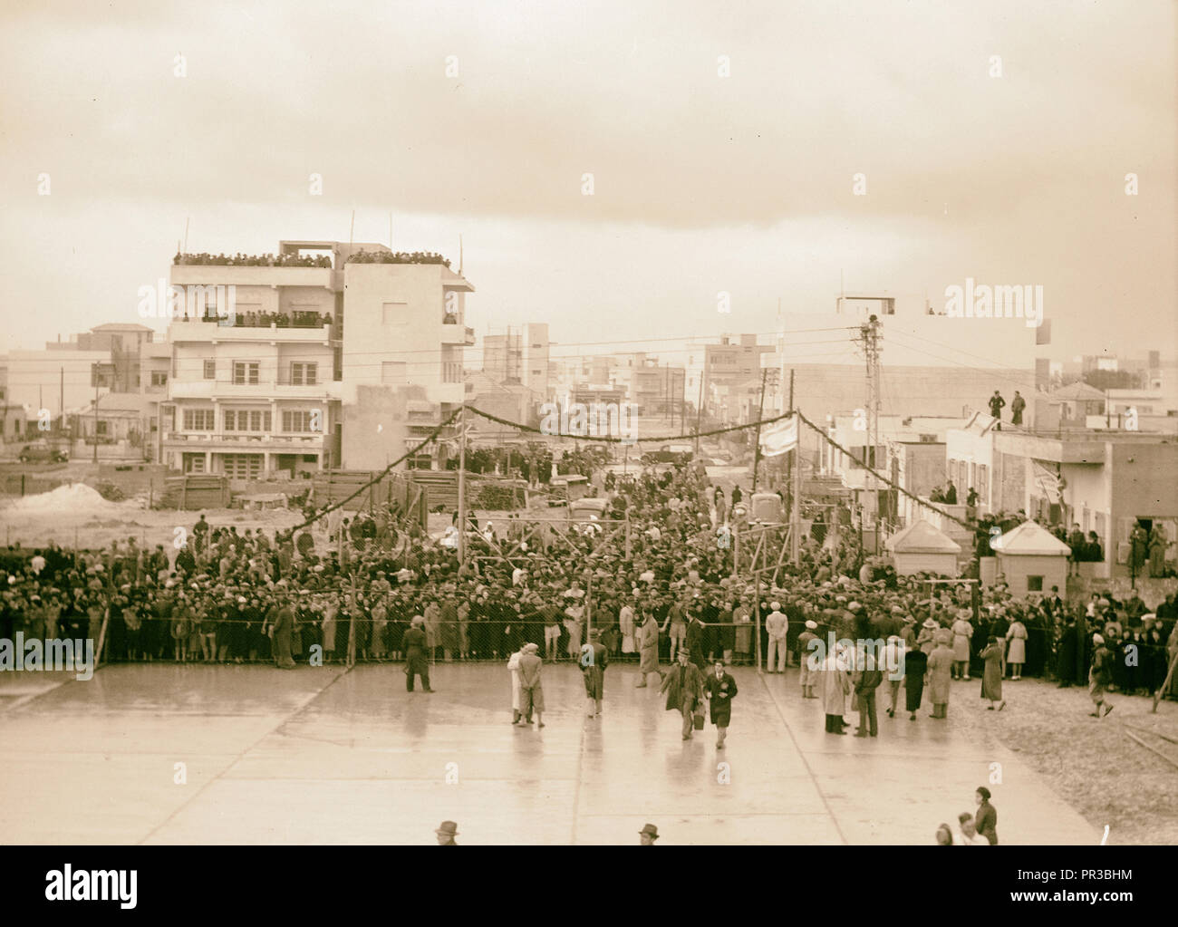Official opening of Tel Aviv Port. Crowds outside harbour enclosure ...