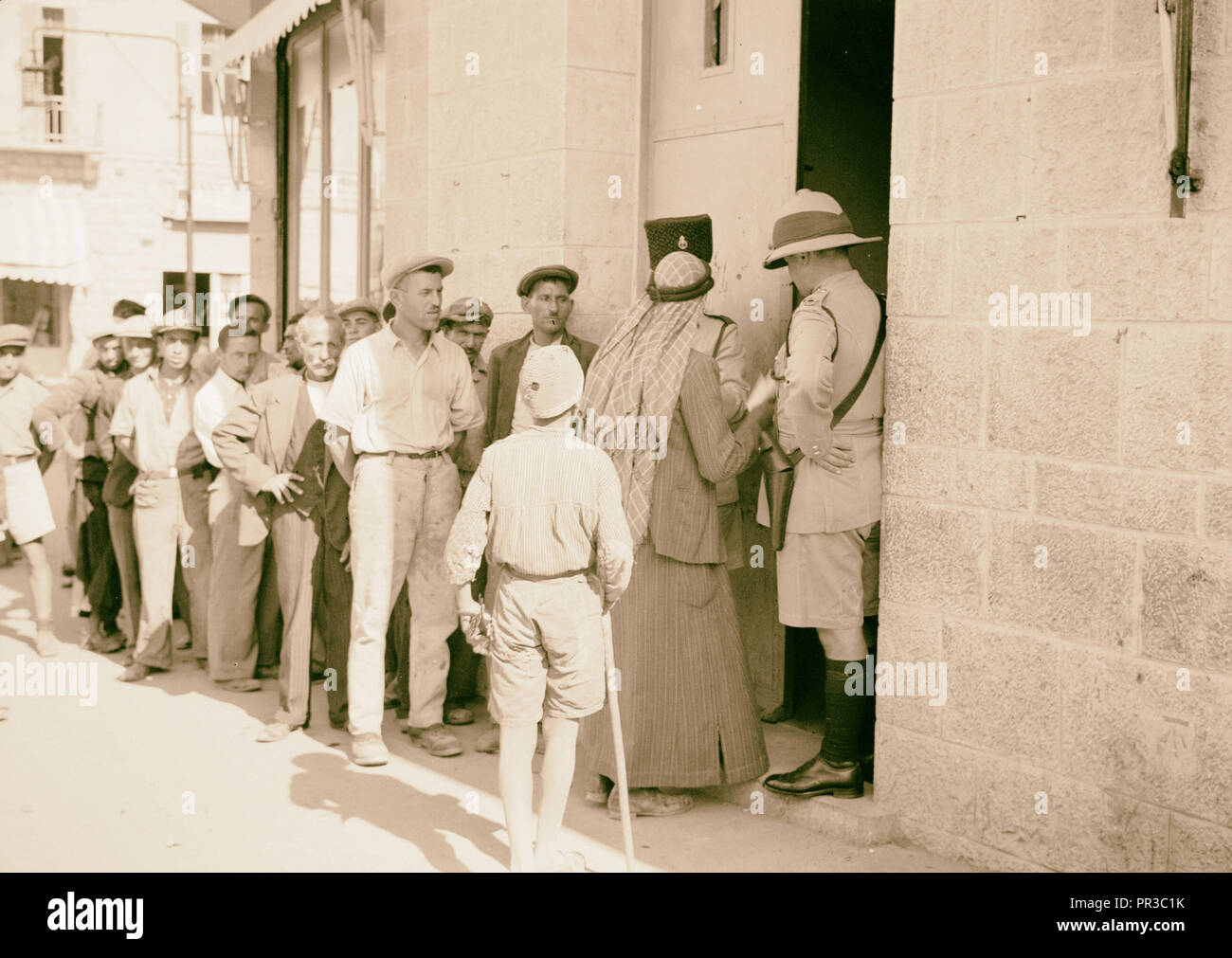 Volunteer queue outside government offices, waiting to register, mostly ...