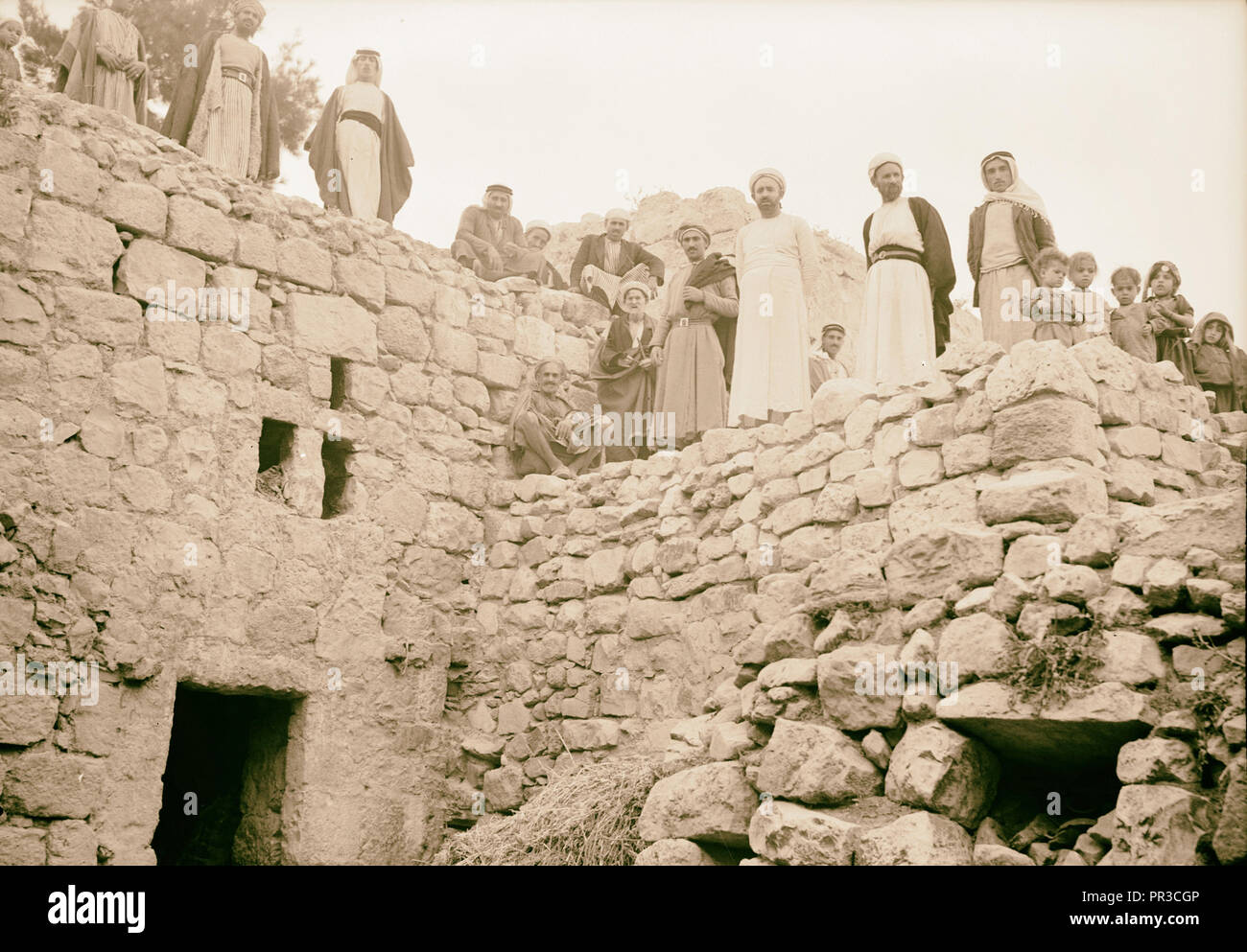 Halhul village at kilometer 30 on Hebron road Villagers on roof of semi ...