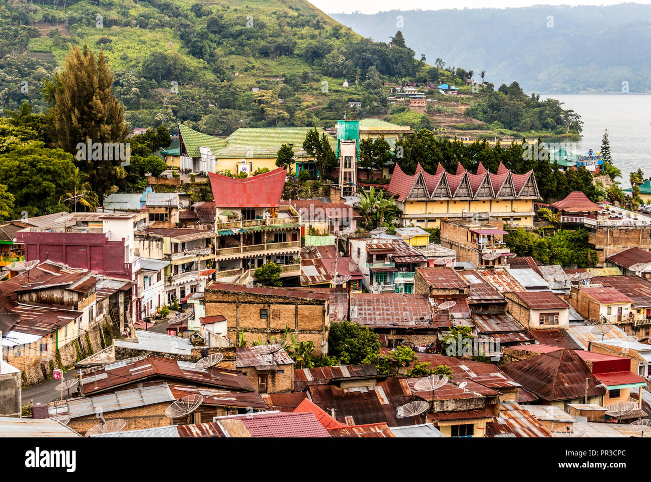Parapat coastal town on banks of Lake Toba in the Uluan Peninsula ...