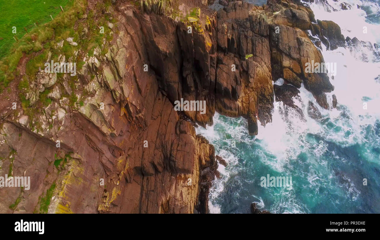 Blue Atlantic Ocean water hits the cliffs of Dingle Peninsula in ...