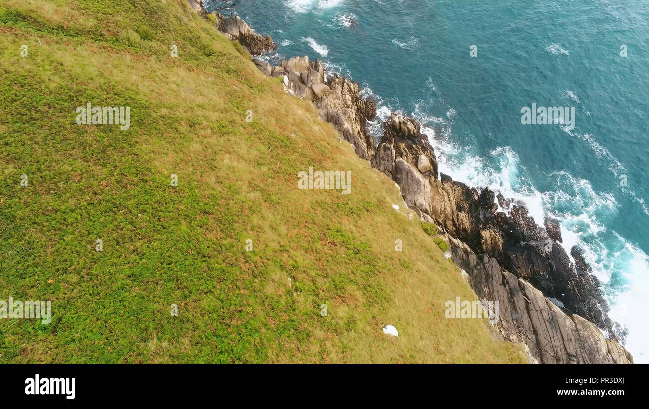 The blue Atlantic Ocean water at the cliffs of Dingle Peninsula – view ...