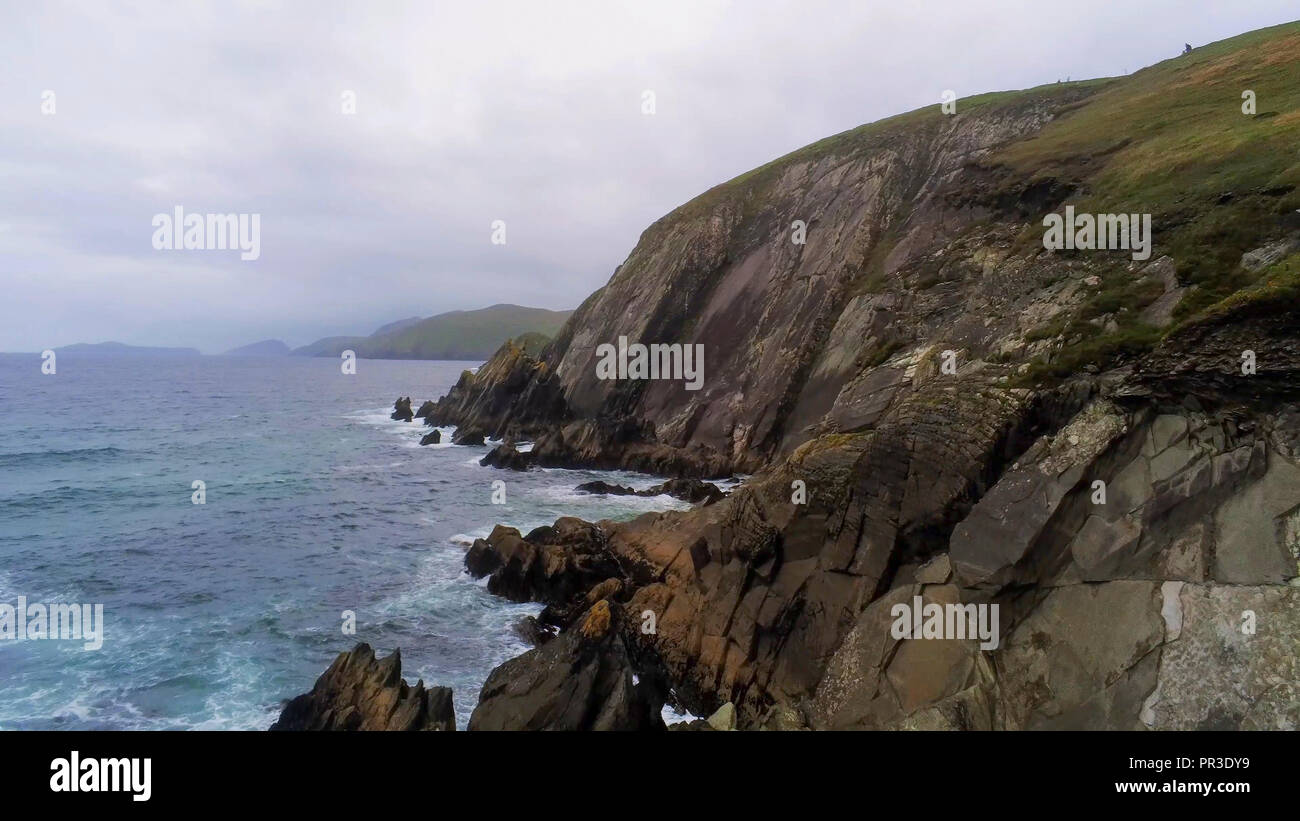Flight along the steep cliffs at Dingle Peninsula in Ireland Stock ...