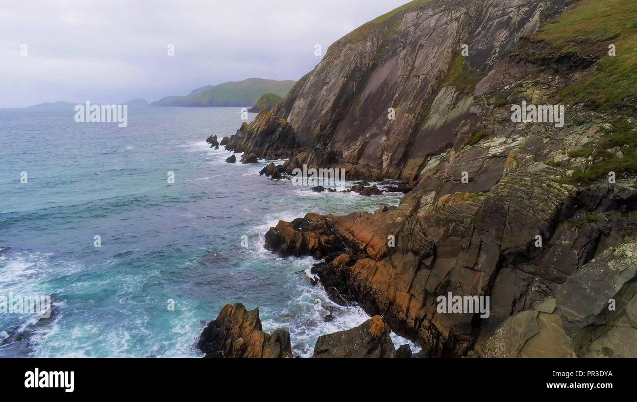 Flight along the steep cliffs at Dingle Peninsula in Ireland Stock ...