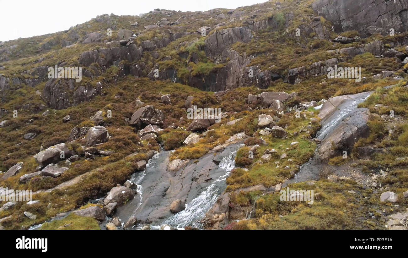 Aerial view over Torc Waterfall at Connor Pass on Dingle Peninsula in ...