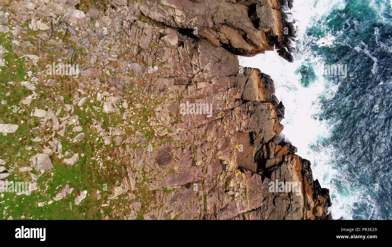 Deep blue ocean water and steep cliffs from above Stock Photo - Alamy