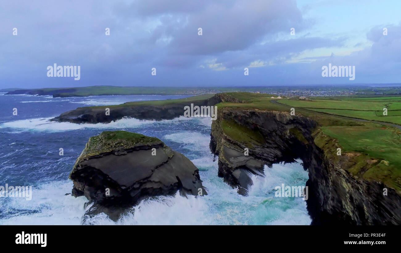 The beautiful steep cliffs of Kilkee at the Irish west coast – aerial ...
