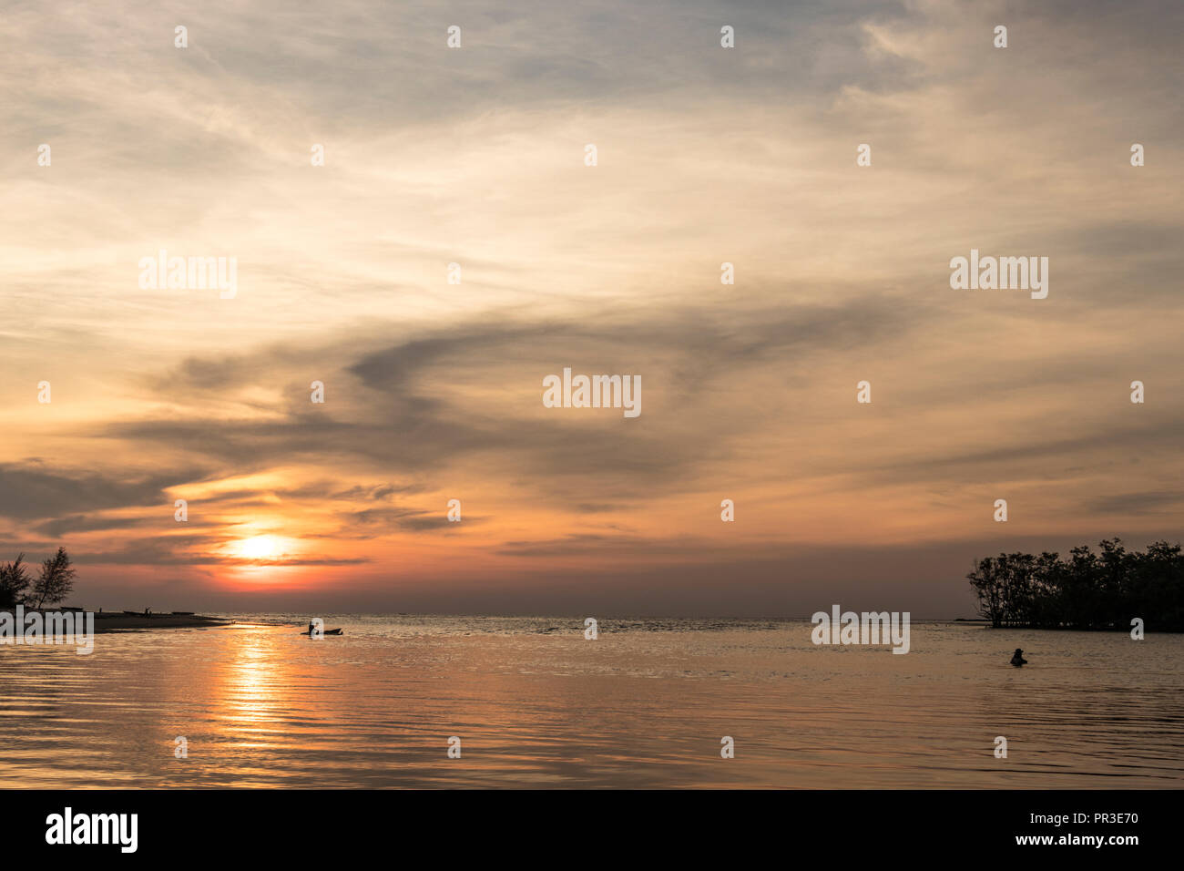 People fishing cockling off coast of Stock Photo - Alamy