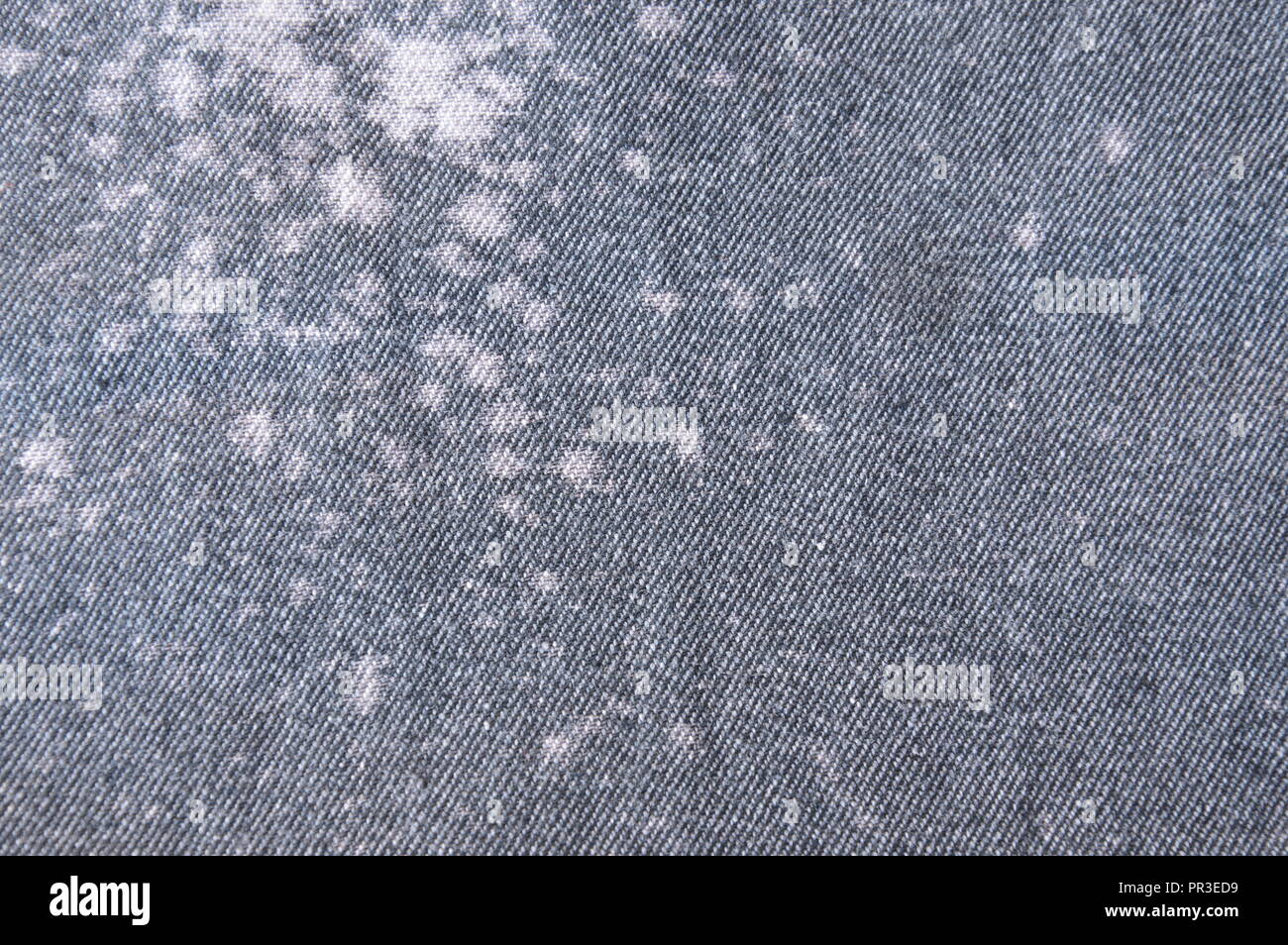 stain on jean fabric texture and background Stock Photo - Alamy