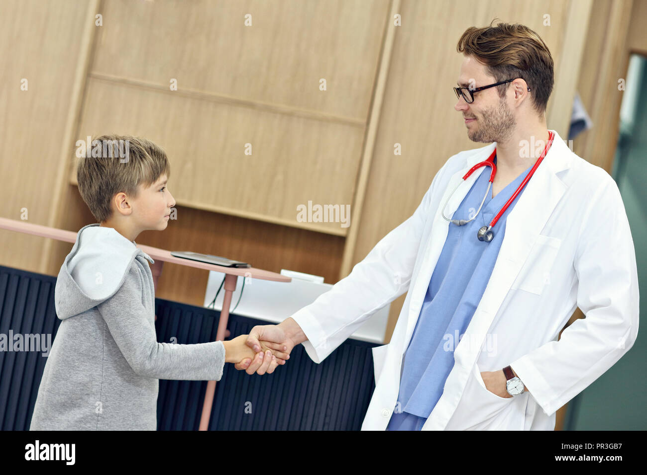 Doctor Examining Young Boy Stock Photos & Doctor Examining Young Boy ...