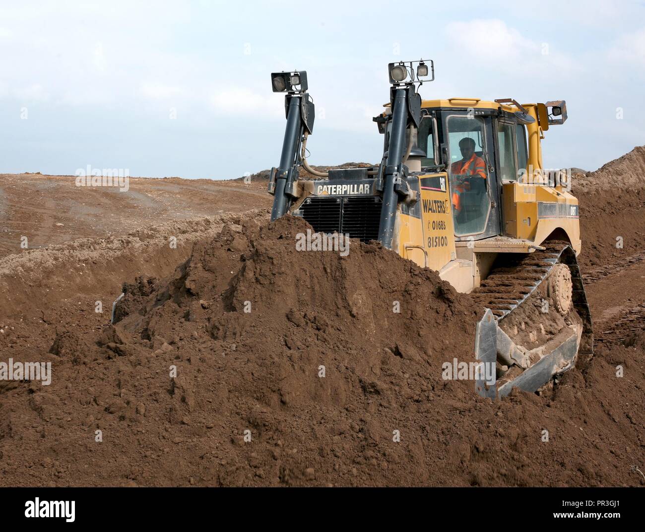A Caterpillar D8T Bulldozer fitted with a semi universal blade and ...