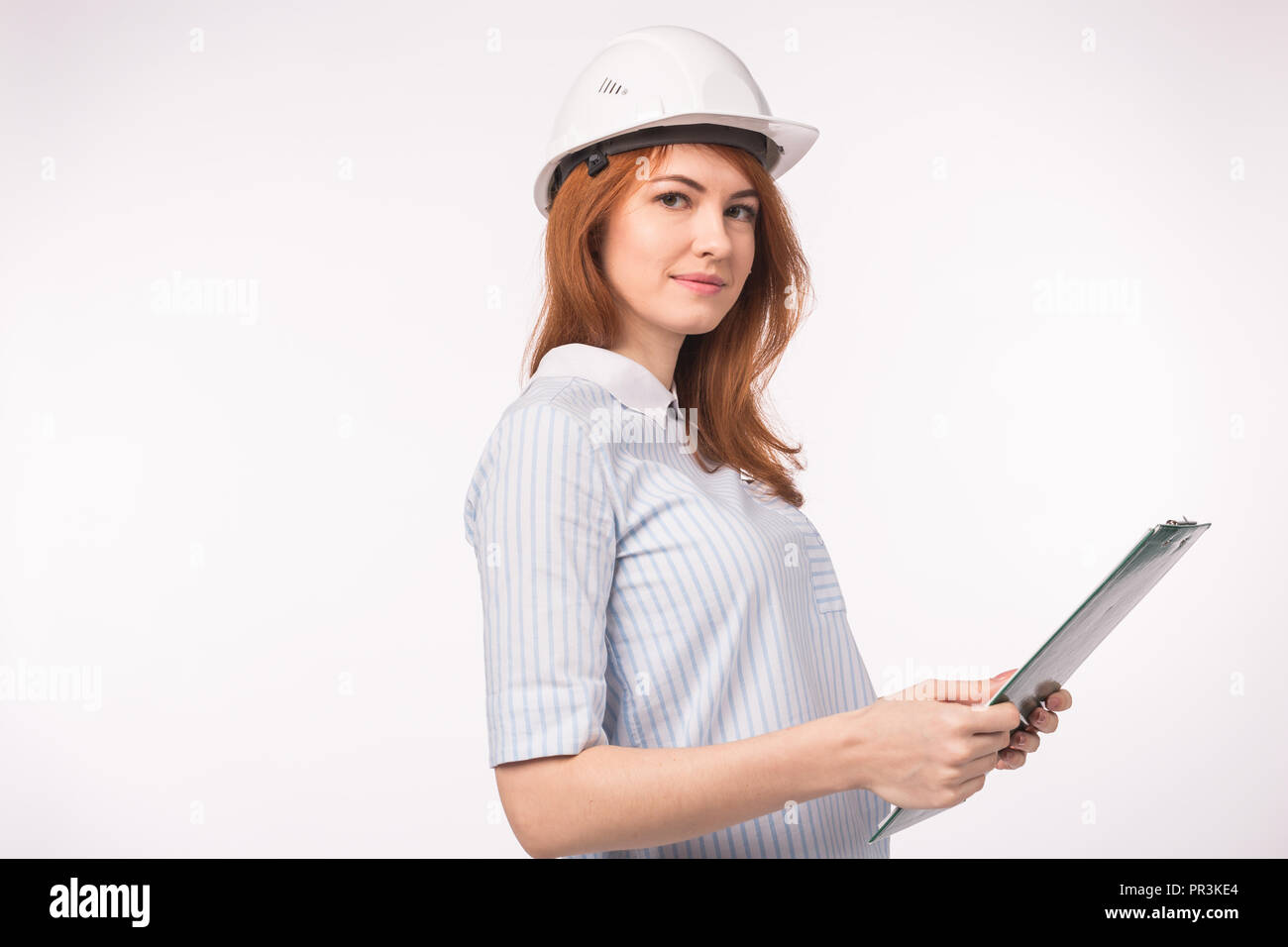 Architect, worker and realtor concept - woman builder or engineer in ...