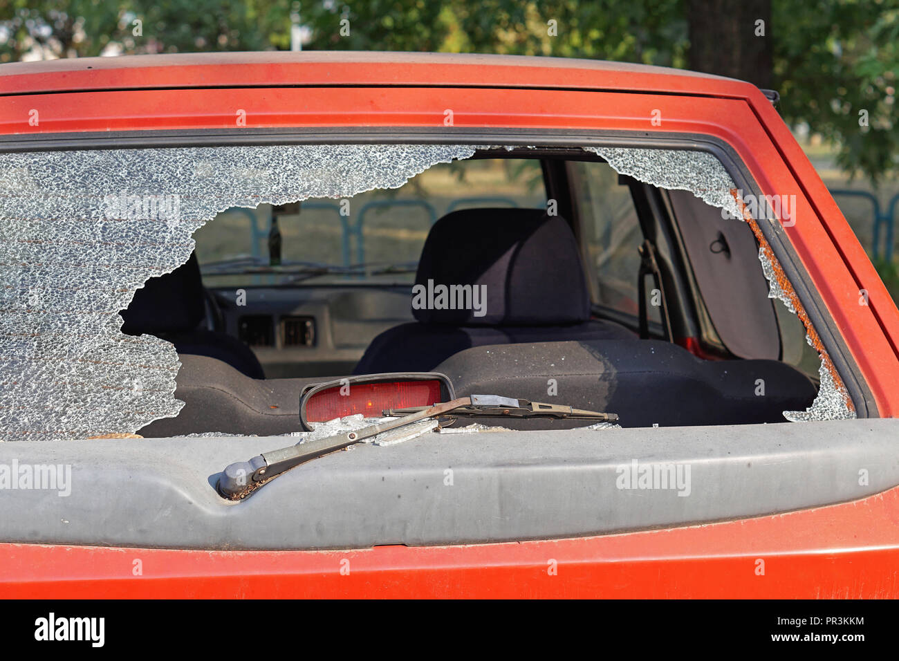 Broken rear car glass burglary damage Stock Photo - Alamy