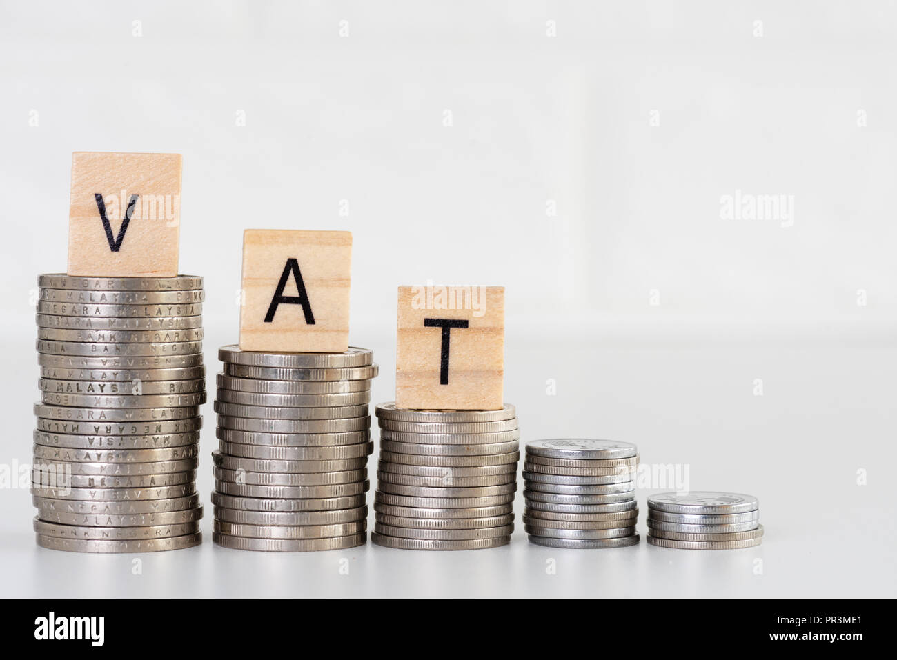 VAT text on stacks of coins. Financial and saving money concept Stock ...