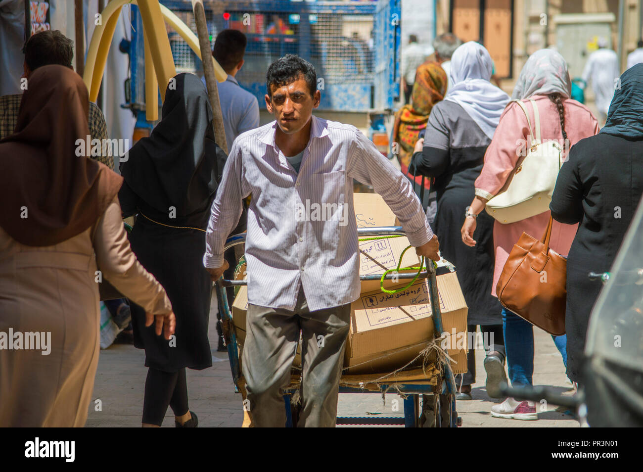 Man pulling trolley hi-res stock photography and images - Alamy
