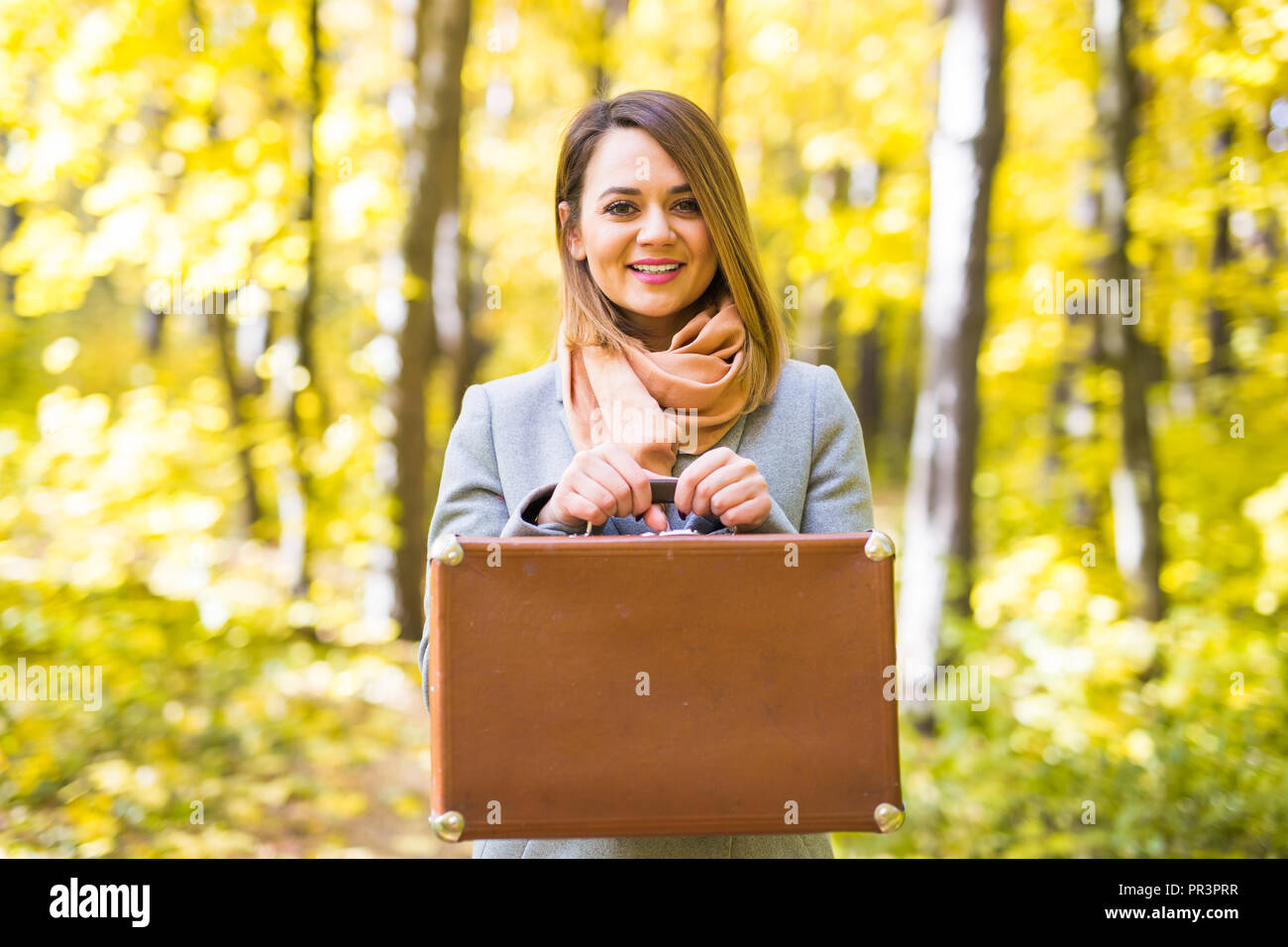 Fall, season and people concept - charming woman standing in park at ...
