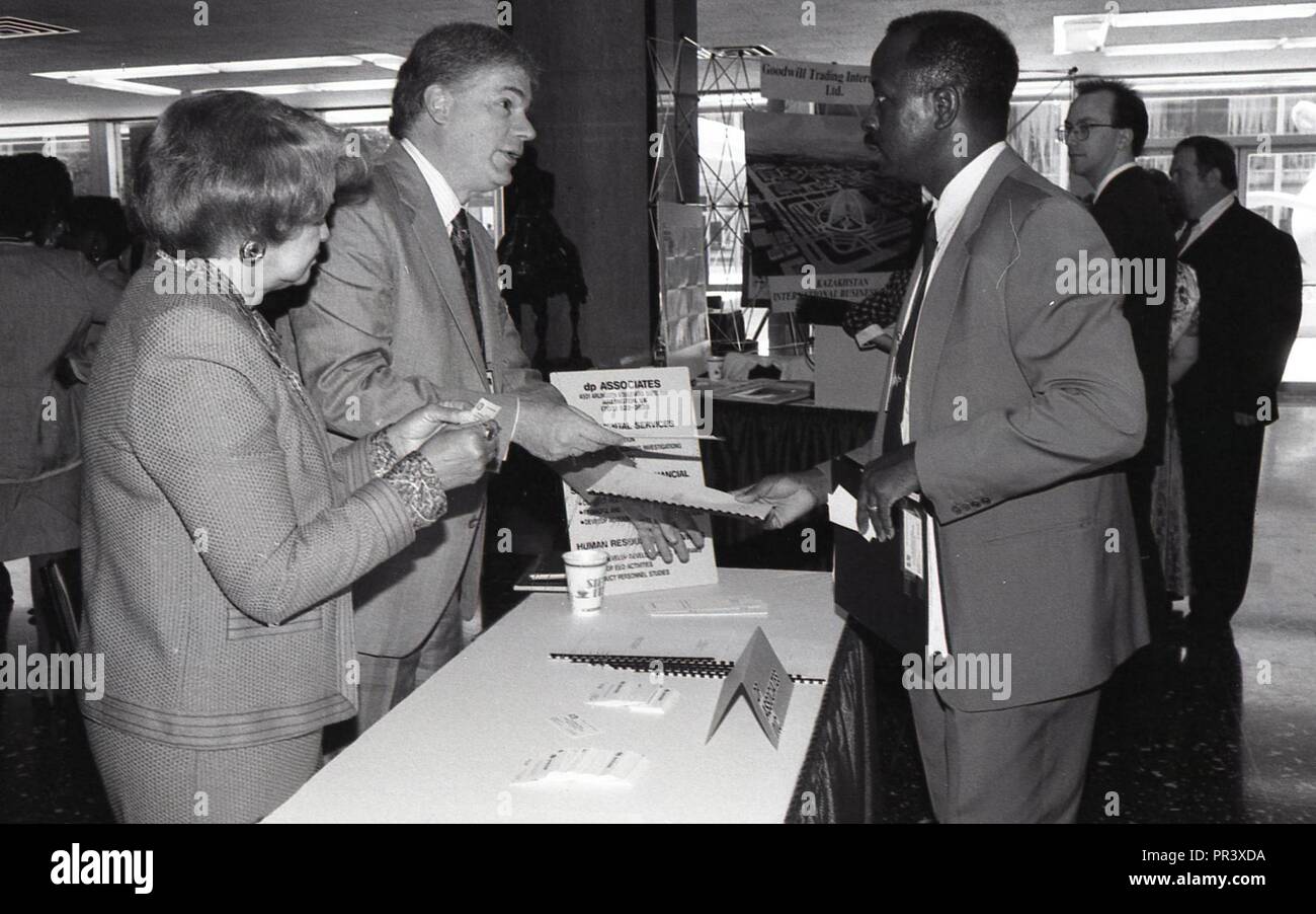 Handing another woman hi-res stock photography and images - Alamy