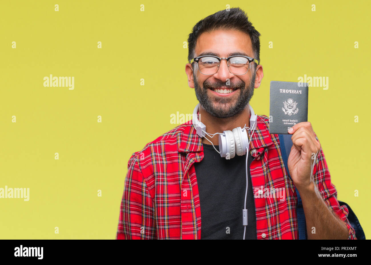 Adult hispanic student man holding passport of america over isolated ...