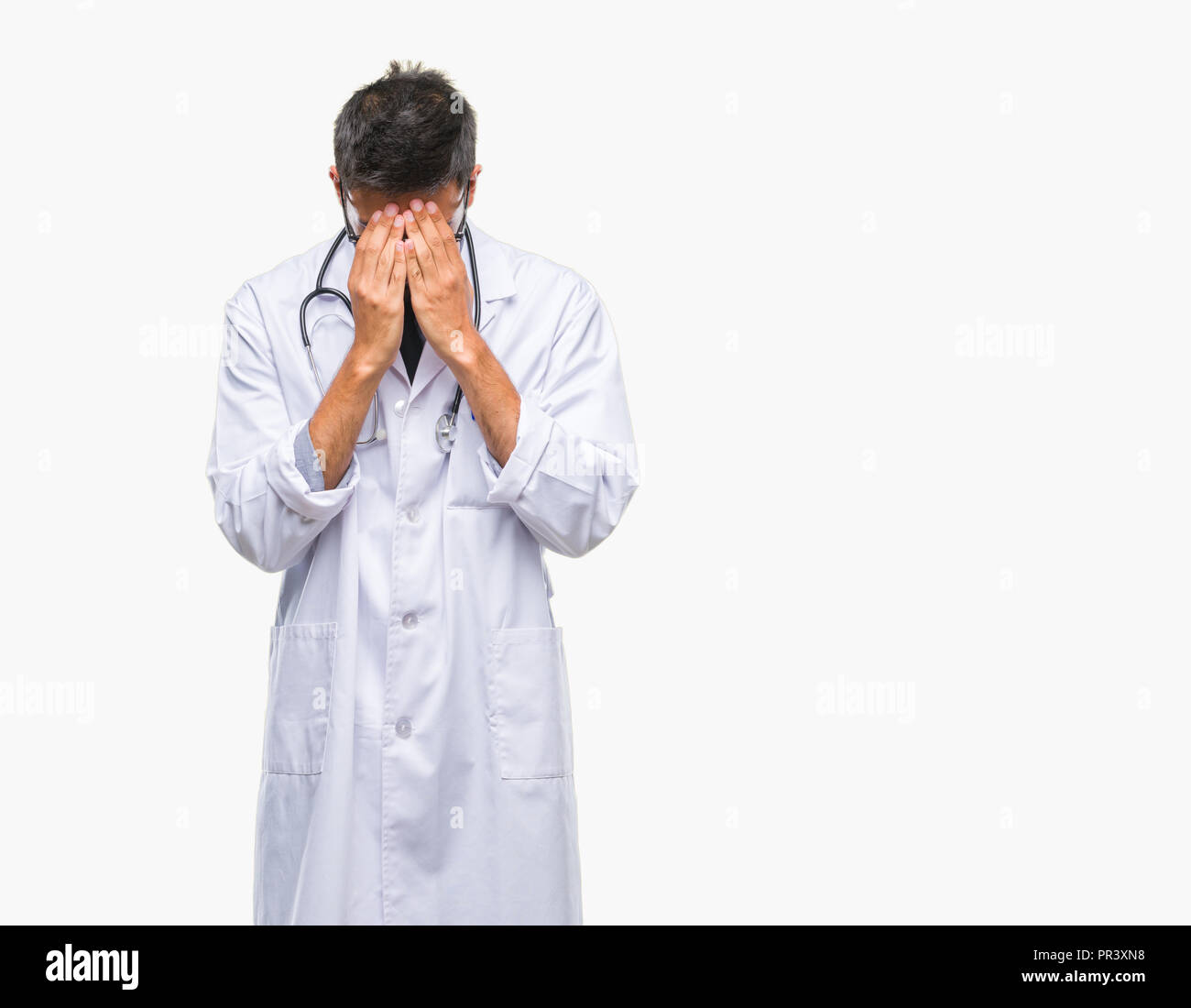 Adult hispanic doctor man over isolated background with sad expression ...