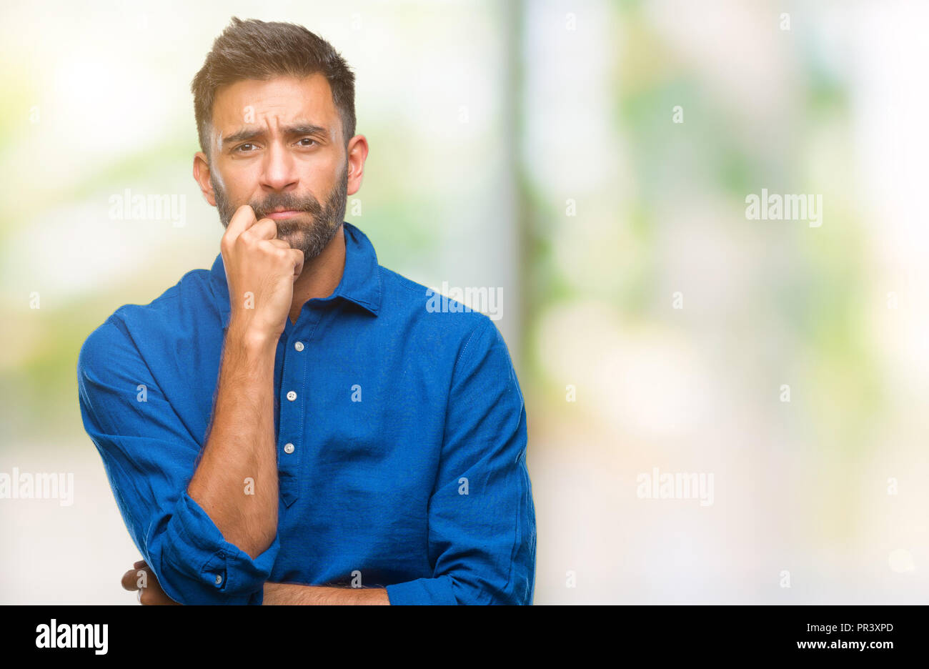Adult hispanic man over isolated background thinking looking tired and ...