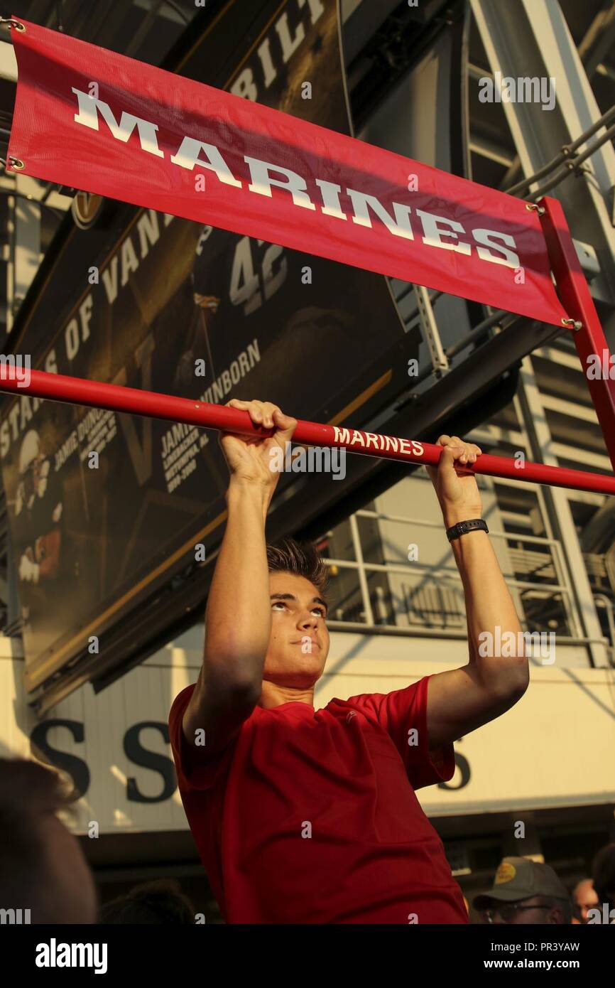 An attendee of the Masters of the Summer Music Games attempts Marine ...