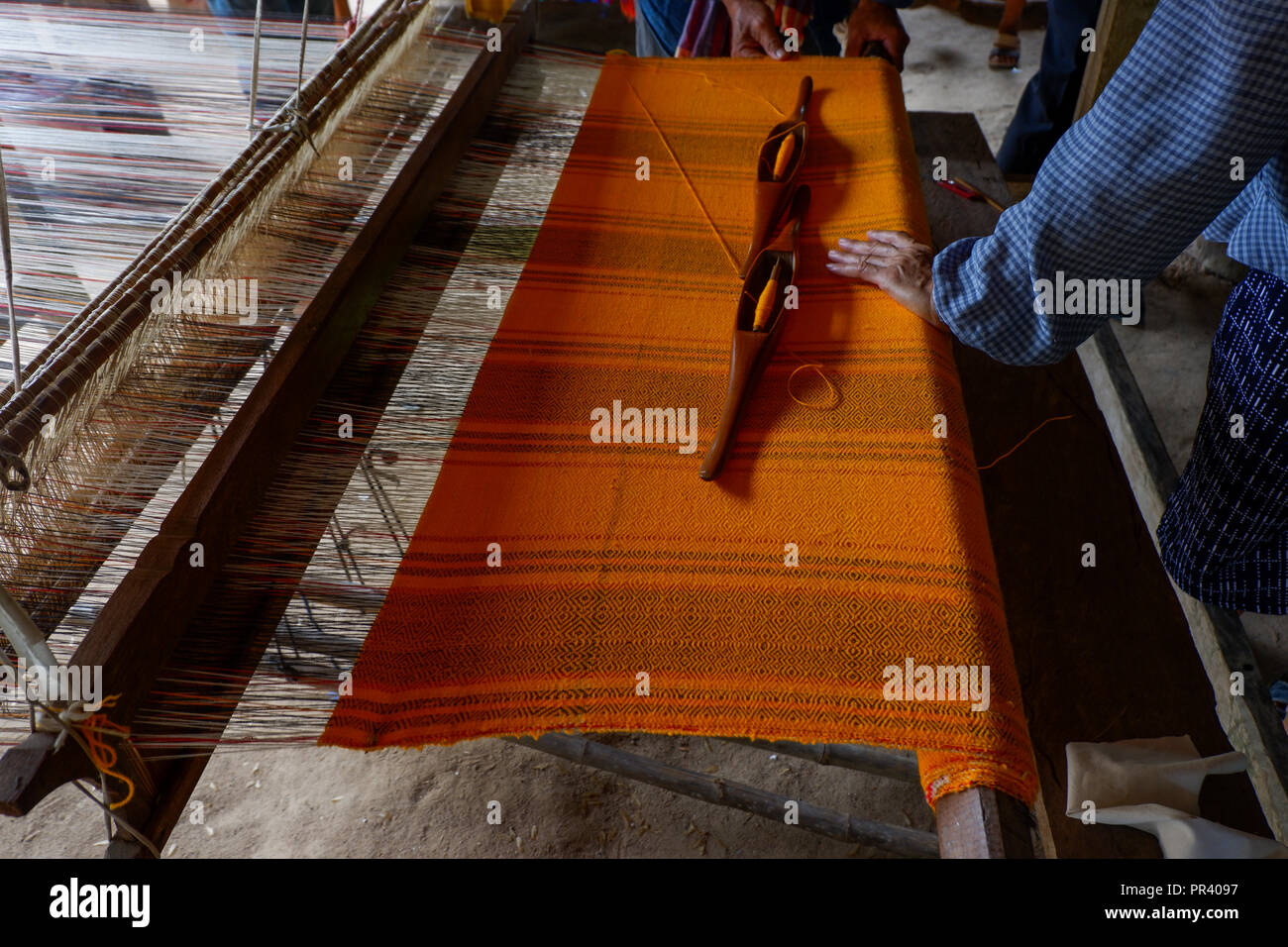 Thai traditional weaving with loom Stock Photo - Alamy