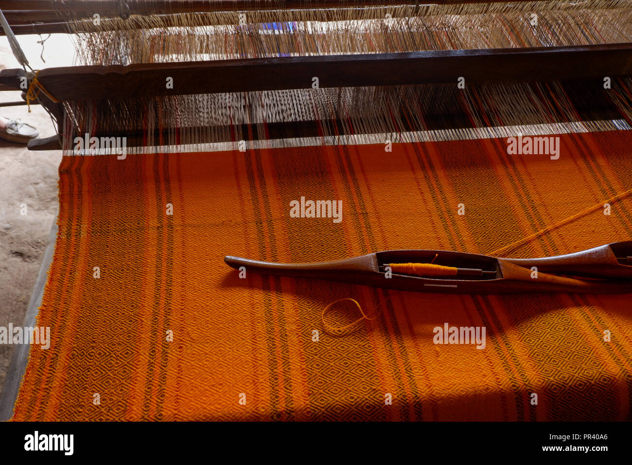 Thai traditional weaving with loom Stock Photo - Alamy