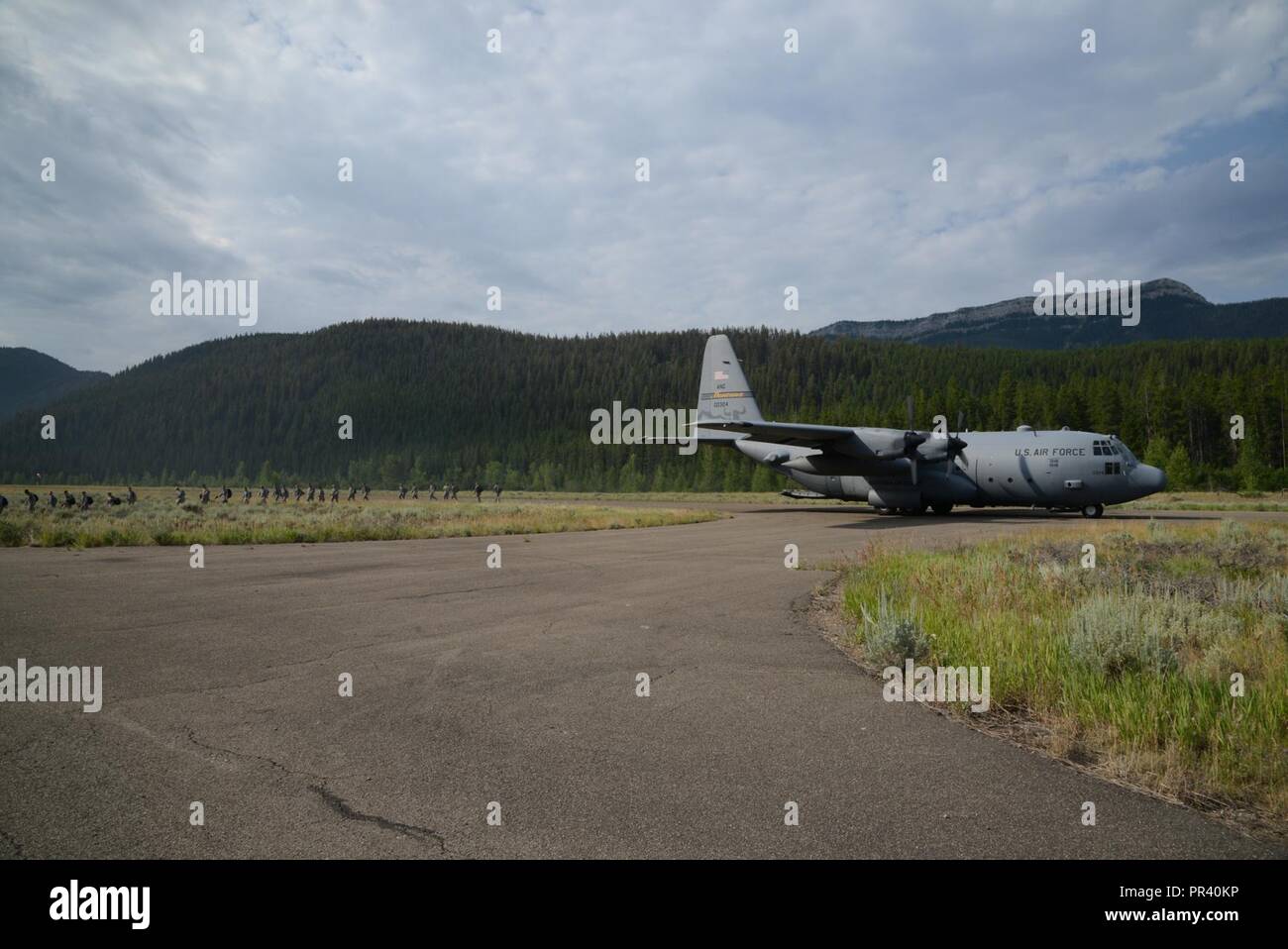 Airmen from the 819th RED HORSE Squadron depart a C-130 Hercules ...