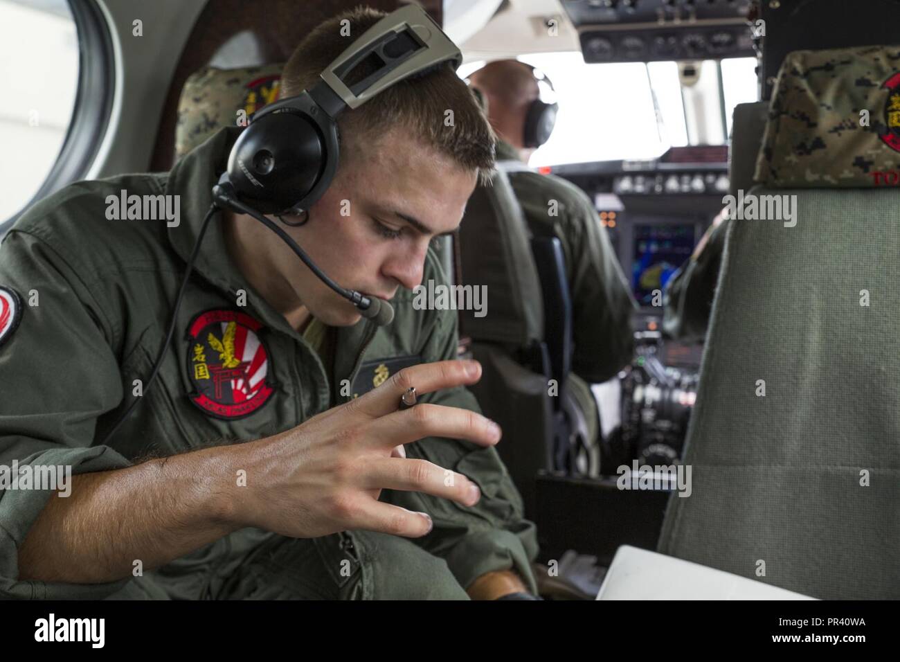 U.S. Marine Corps Lance Cpl. Jason Roos, a fixed-wing transport ...