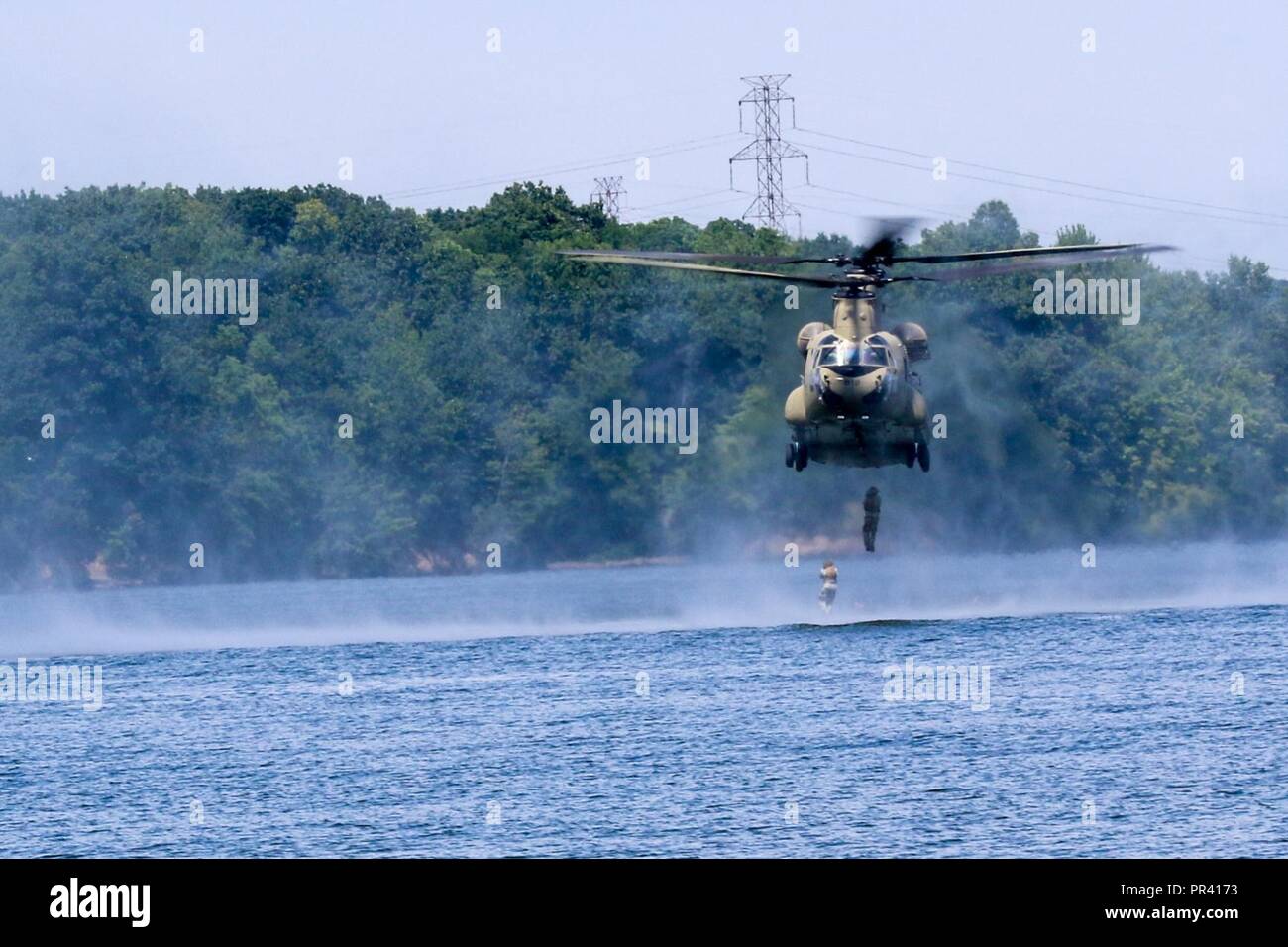 Soldiers with the 2nd Squadron, 107th Cavalry Regiment, leap from a CH ...