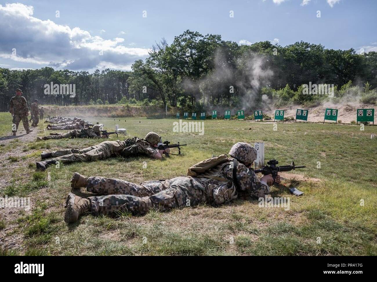 Danish and Latvian Soldiers side by side at the shooting-range Stock ...