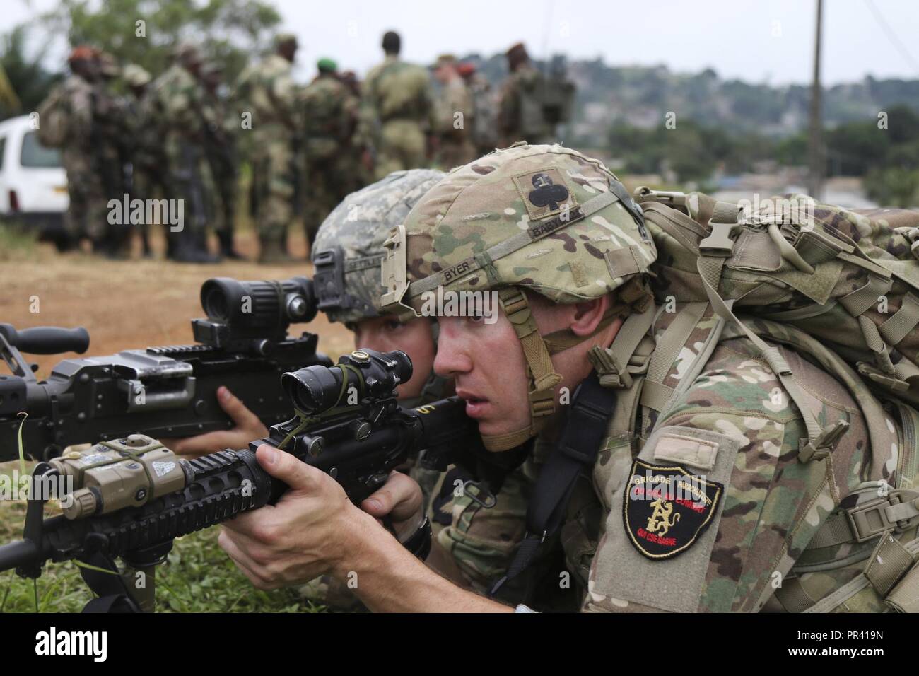 Sgt. Garrett Byer, (foreground), and Pvt. Jacob Settles, both Soldiers ...