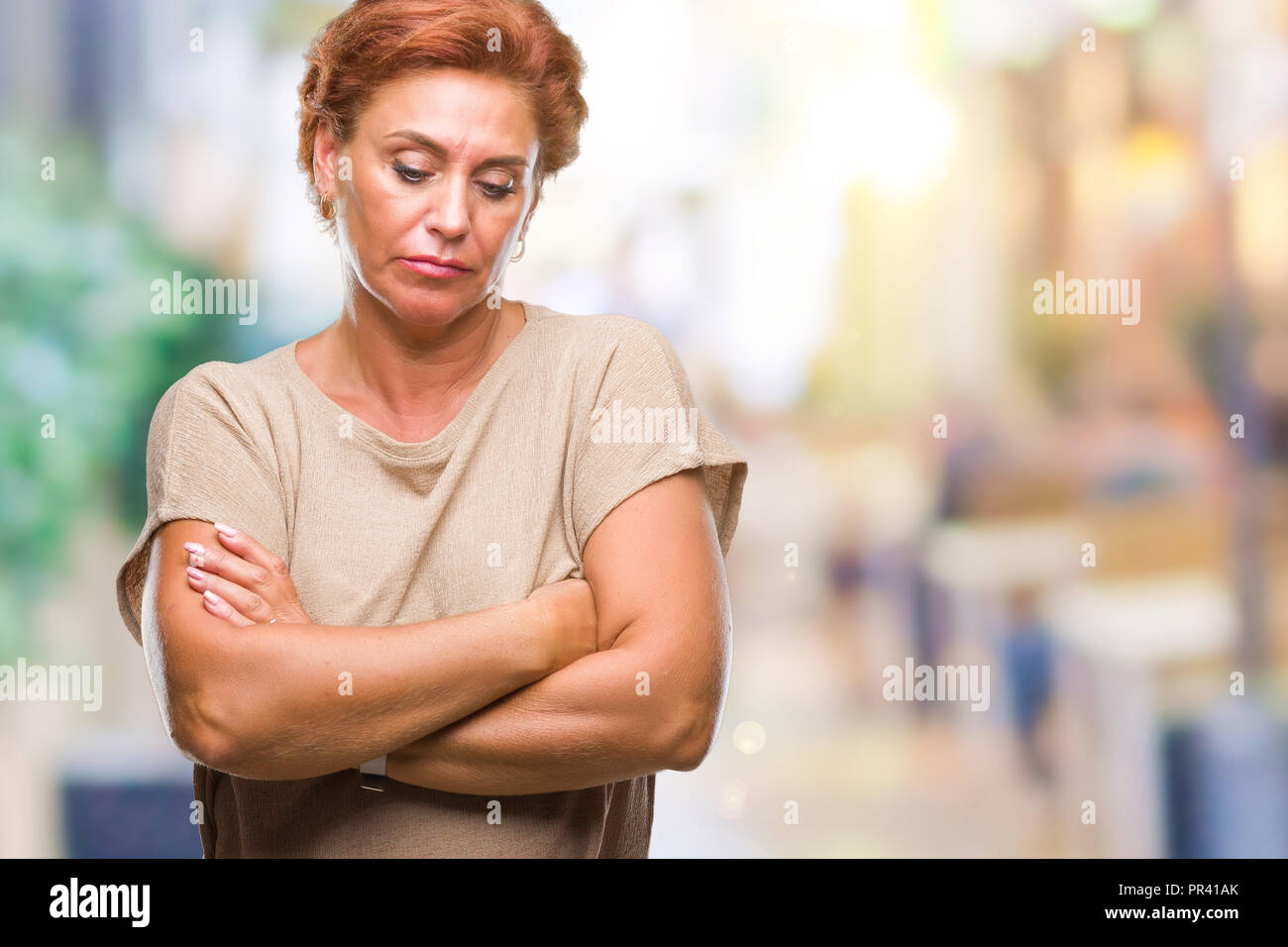 Atrractive senior caucasian redhead woman over isolated background ...