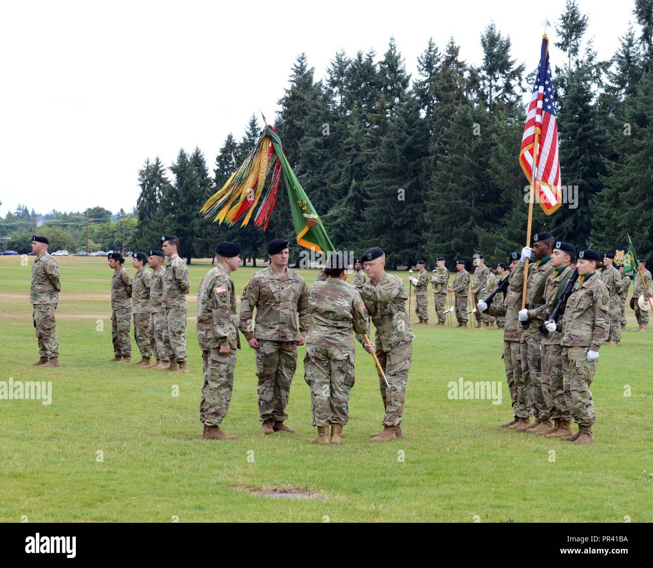 Command Sergeant Major CSM Richard Lopez (right) begins the passing of ...