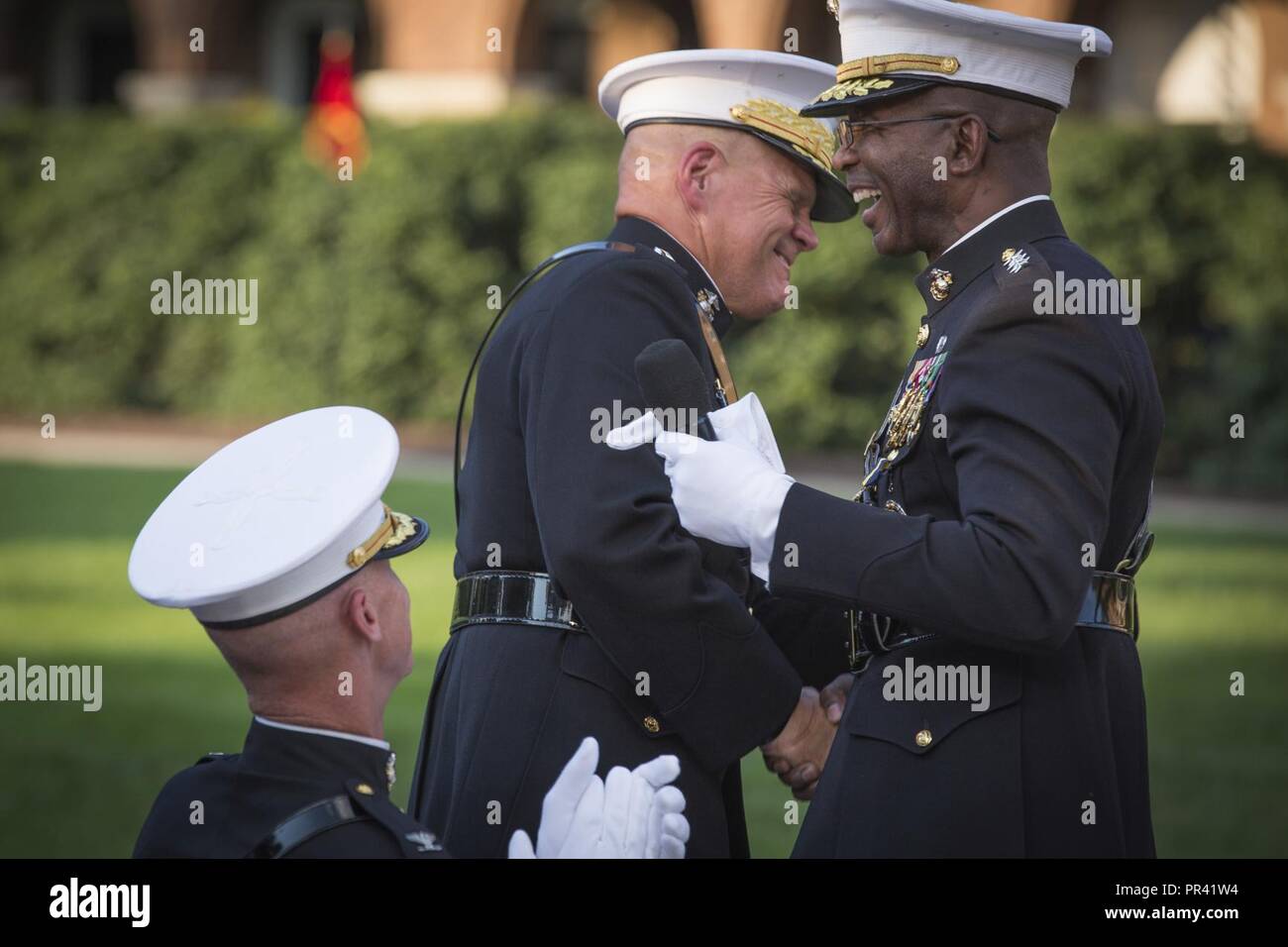 Commandant of the Marine Corps Gen. Robert B. Neller, left, shakes the ...