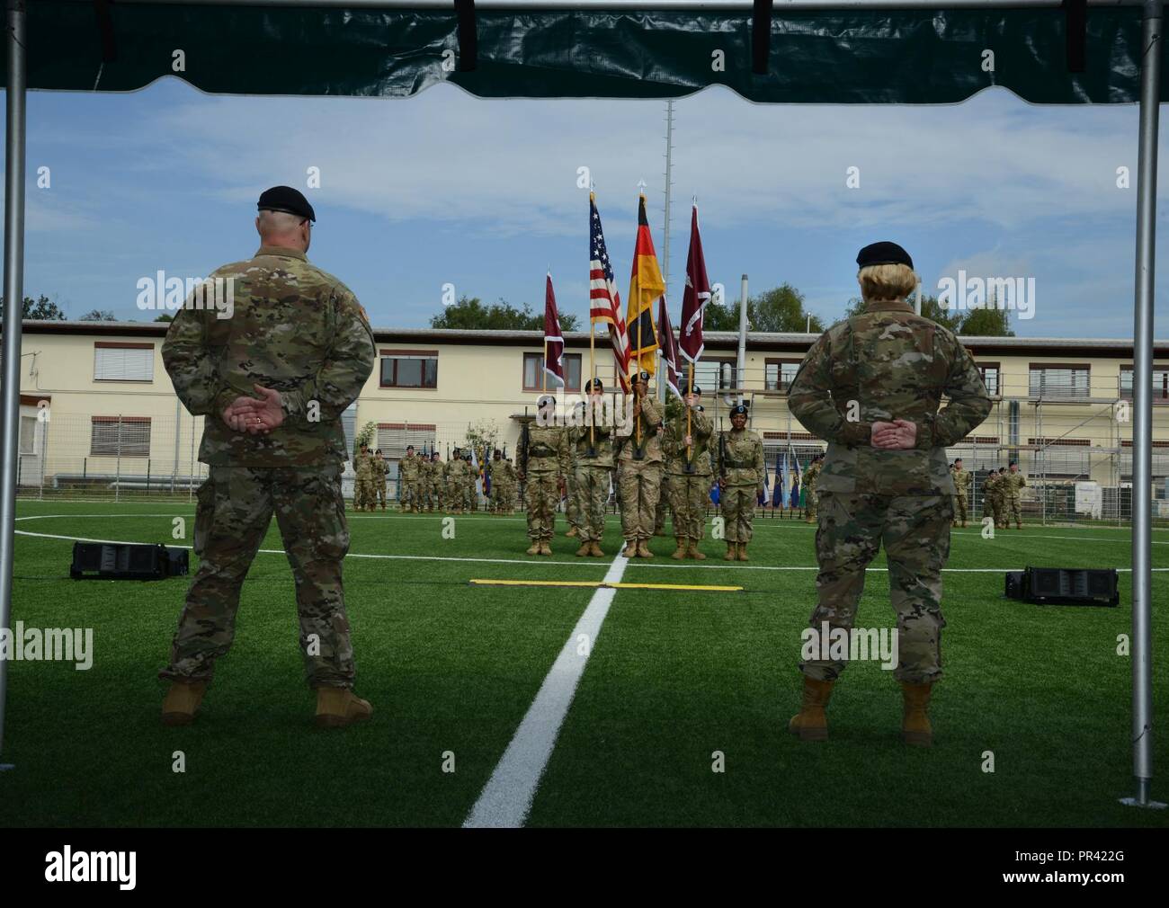 The incoming and outgoing commanders stand before the formation of troops during the Public ...