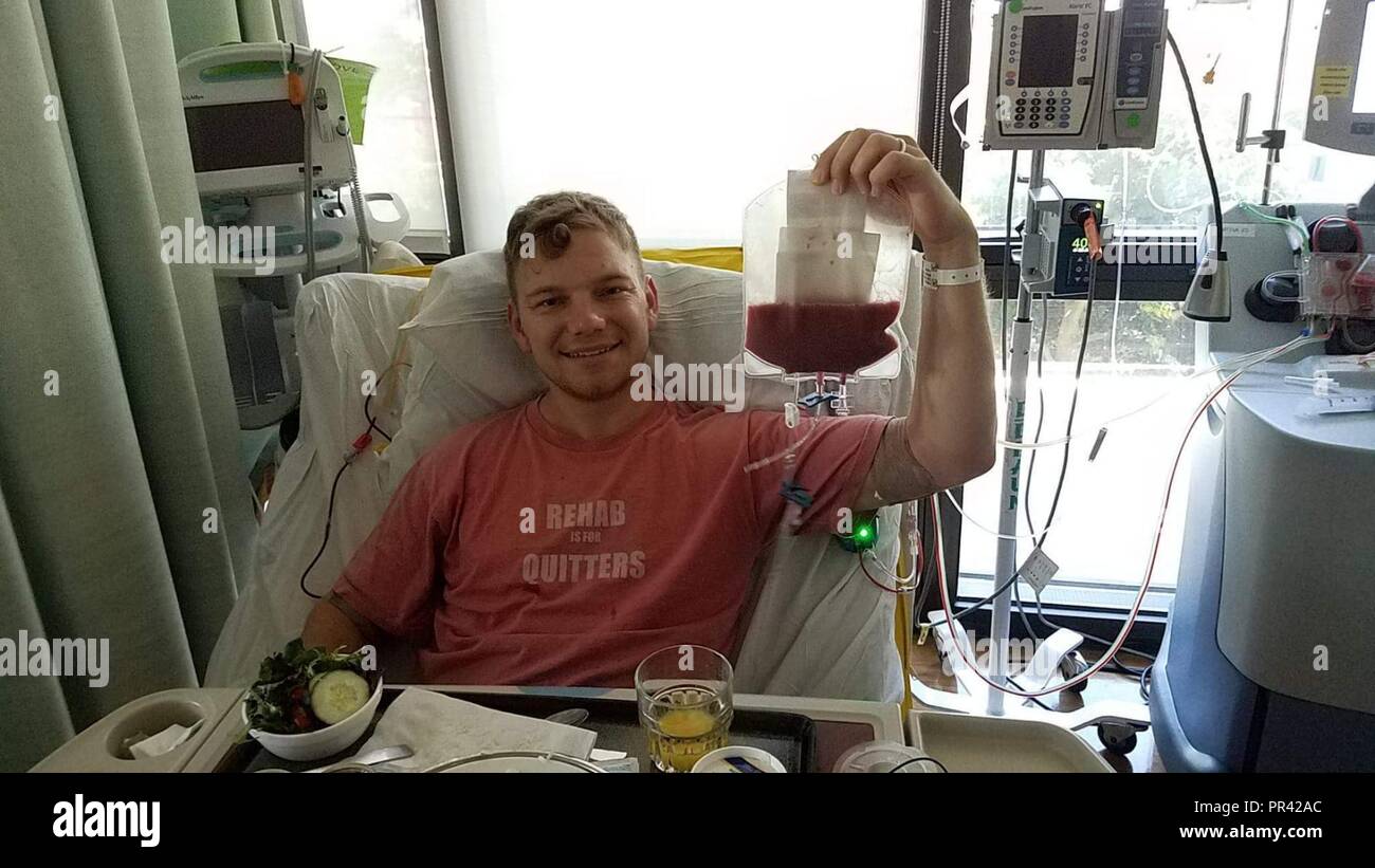Staff Sergeant Andrew Tymczyszyn holds the bag of his bone marrow for ...