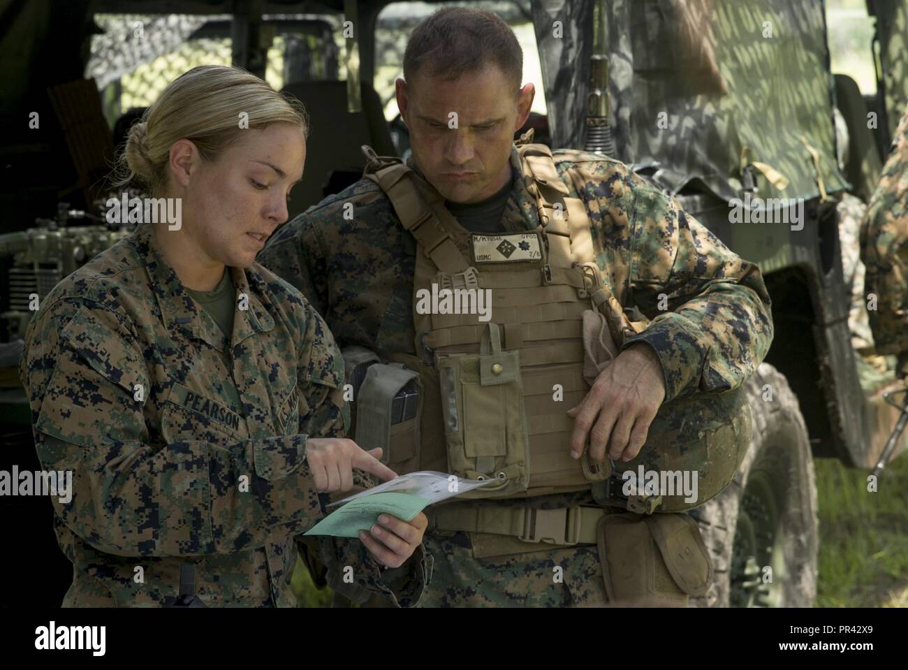 U.S. Marine Corps 1st Lt. Kate A. Pearson, left, a field artillery ...